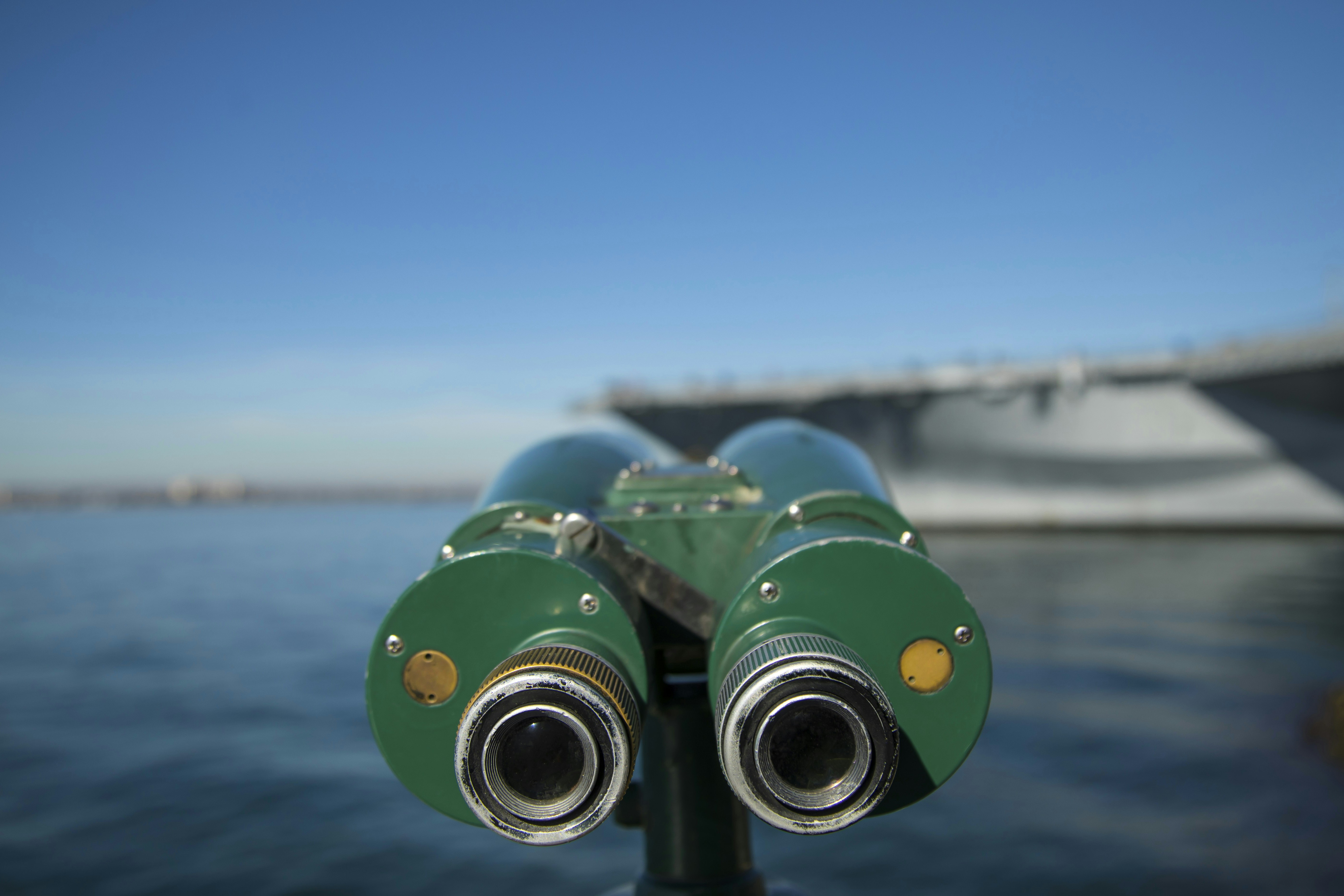 Emerald Twin Eyepieces Over a Quiet Harbor