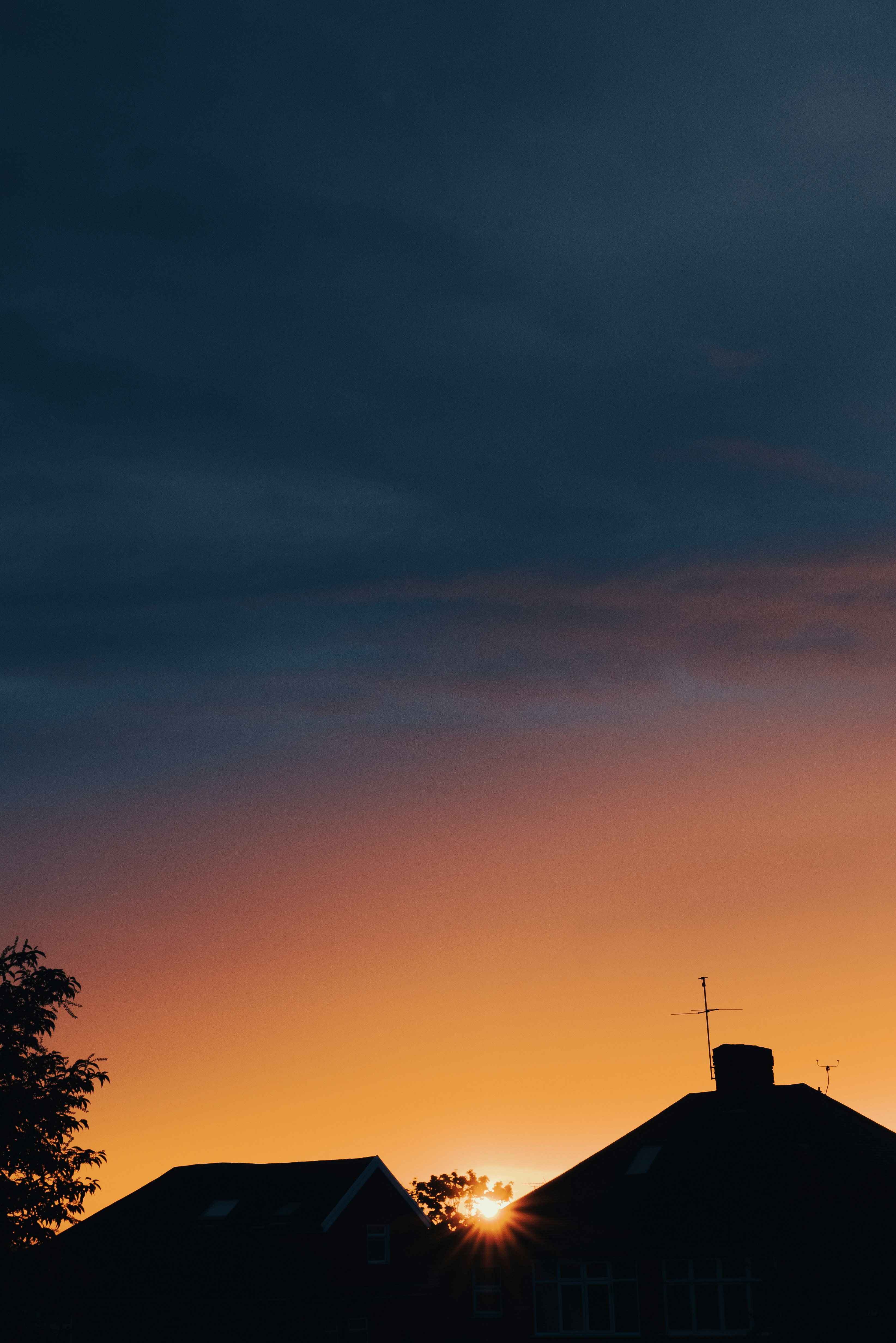 A sunset over houses photo – Free Iphone wallpaper Image on Unsplash