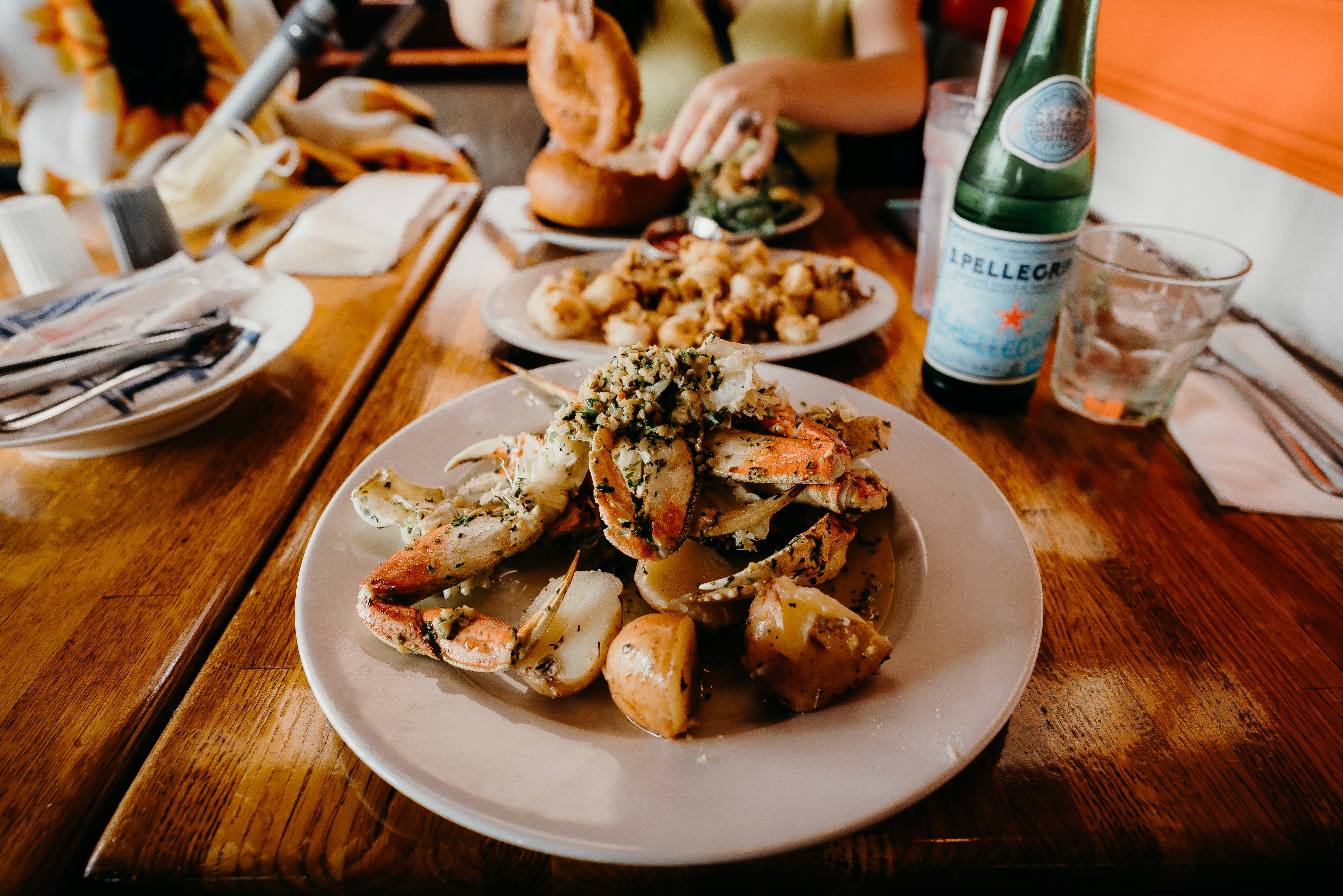 Cracked-shell feast: a shared plate of seafood at a sunlit table