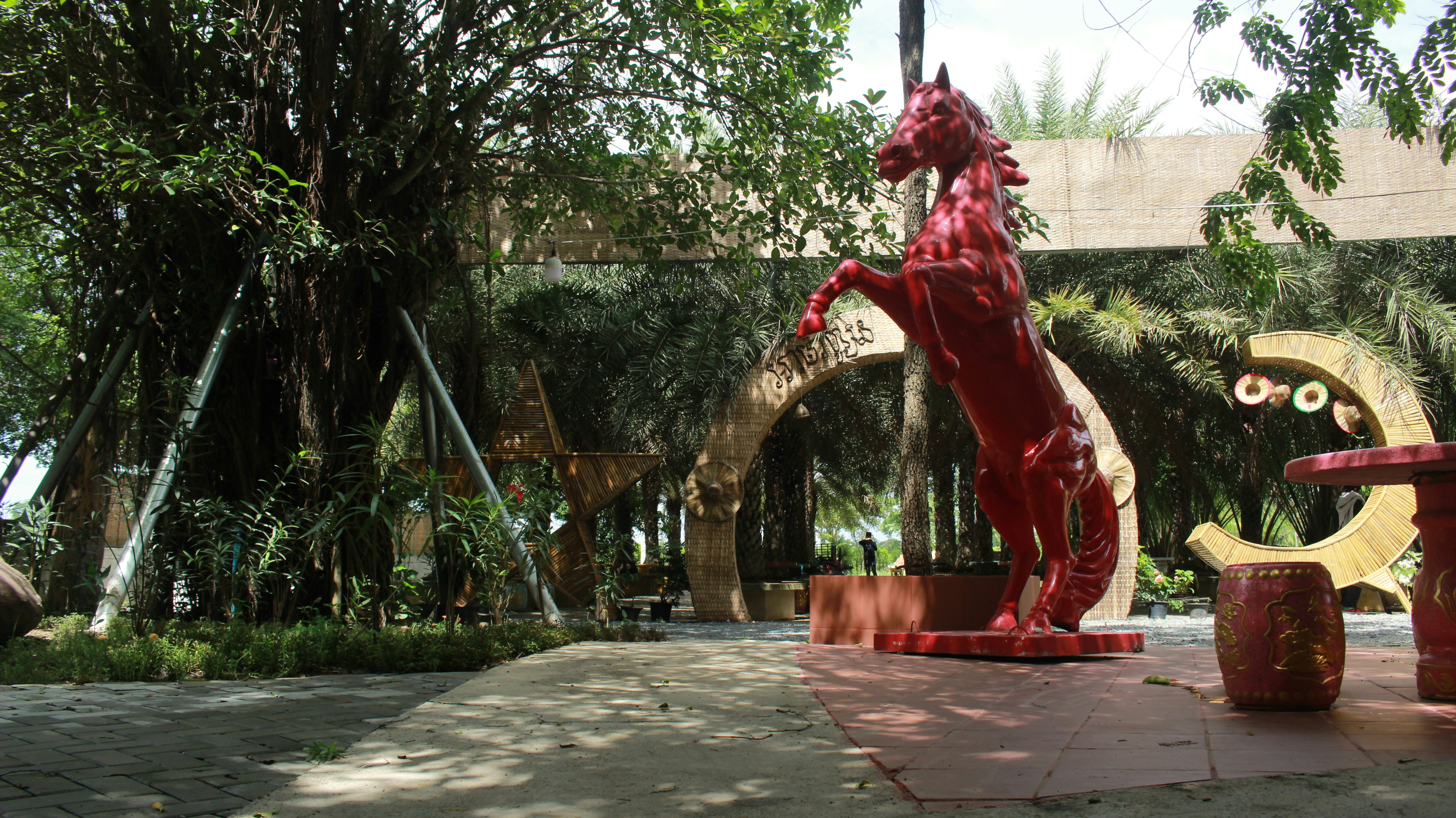 a statue of a person in a red suit