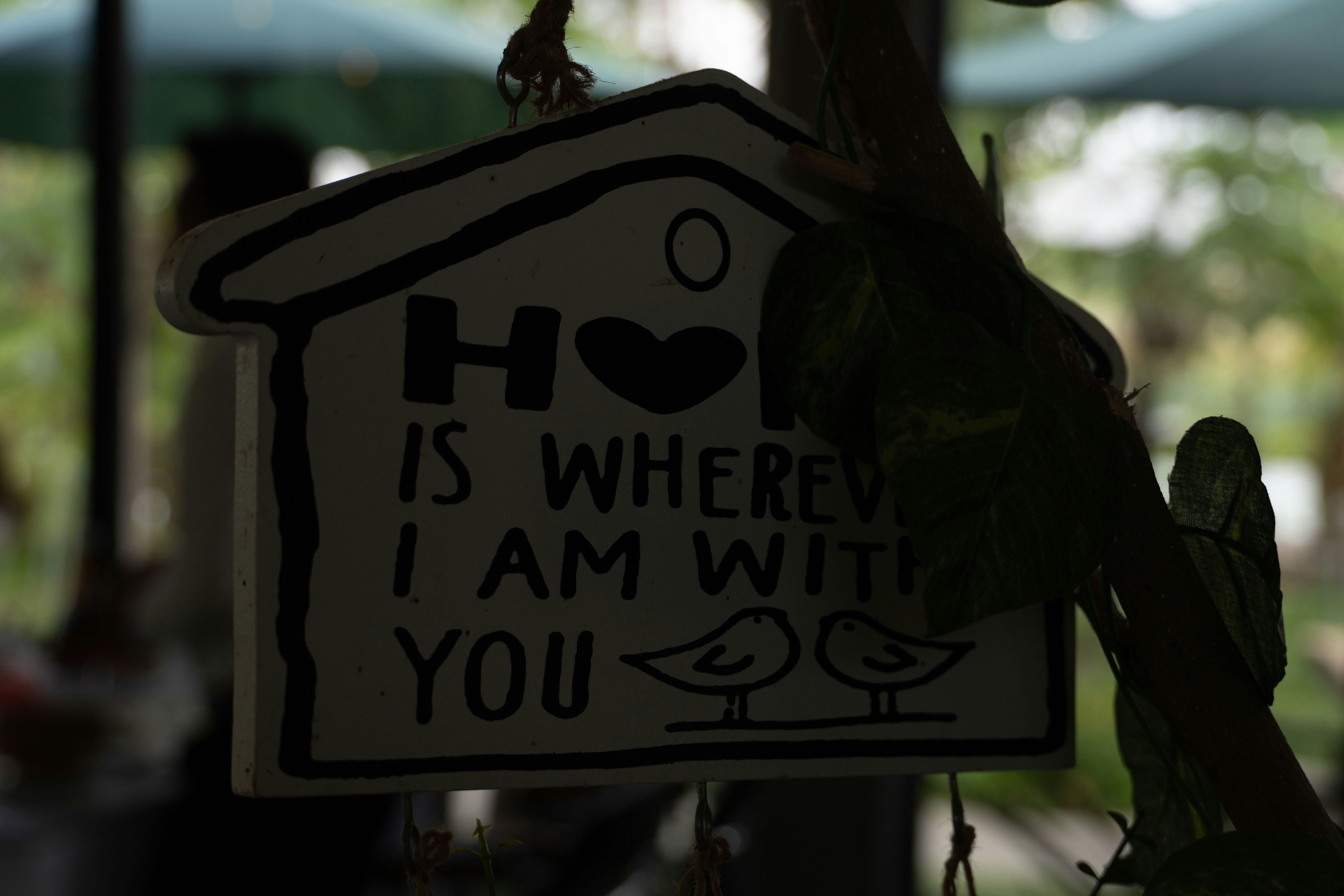Hanging Love Sign in Dappled Café Shade