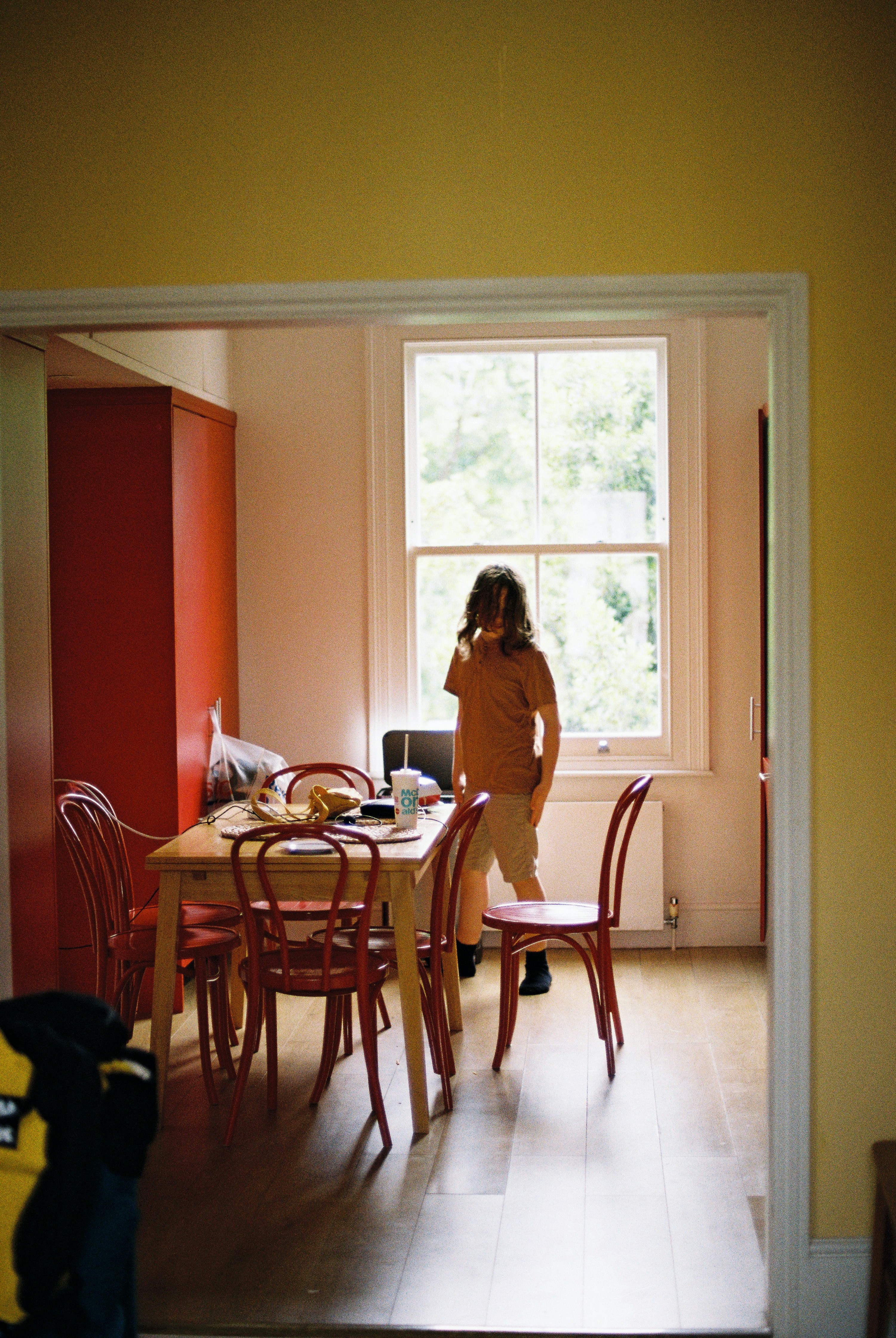 Window Light Moment: A Girl at the Kitchen Window