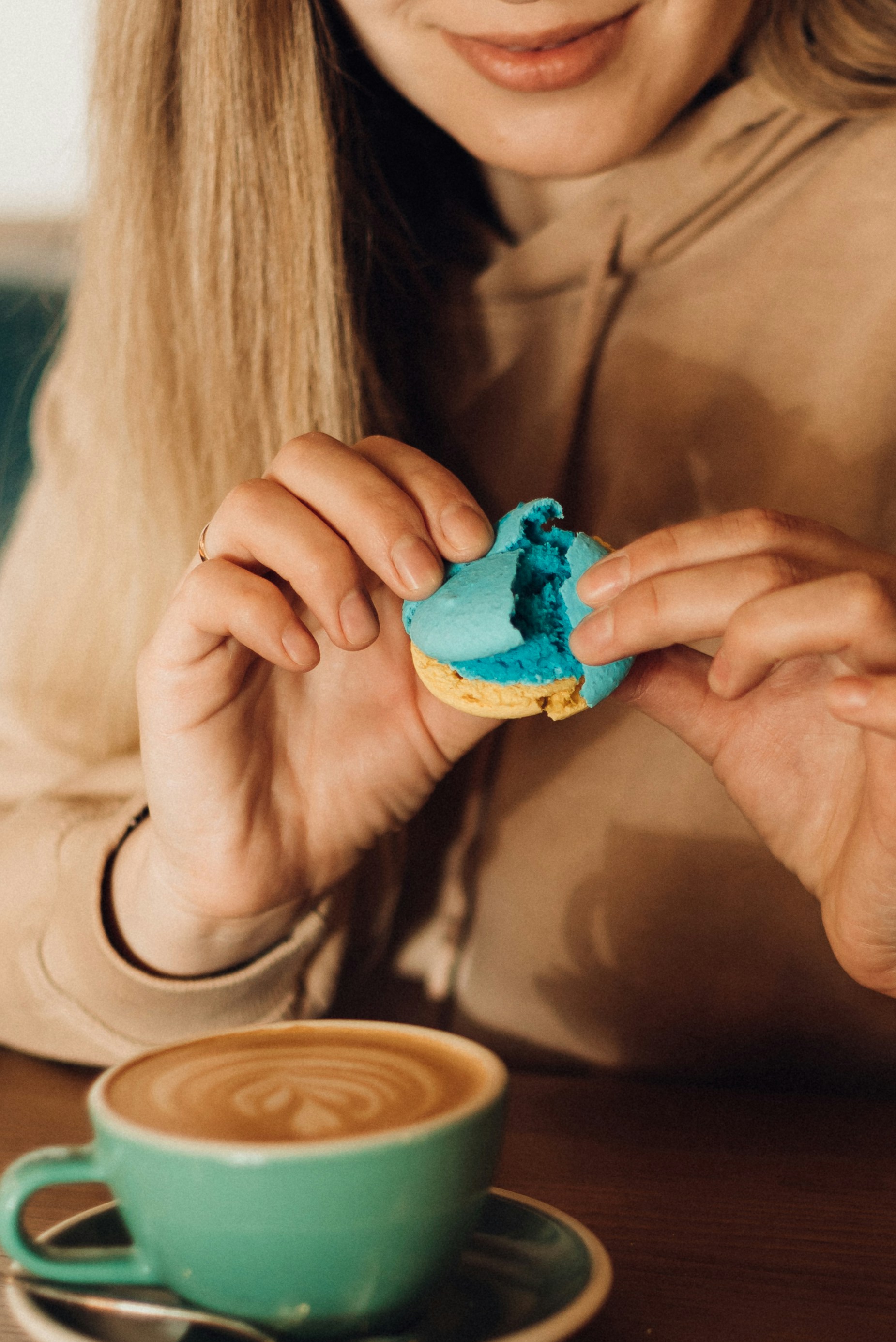 Turquoise Macaron Moment: A Bite-Sized Pop of Color in a Cozy Café