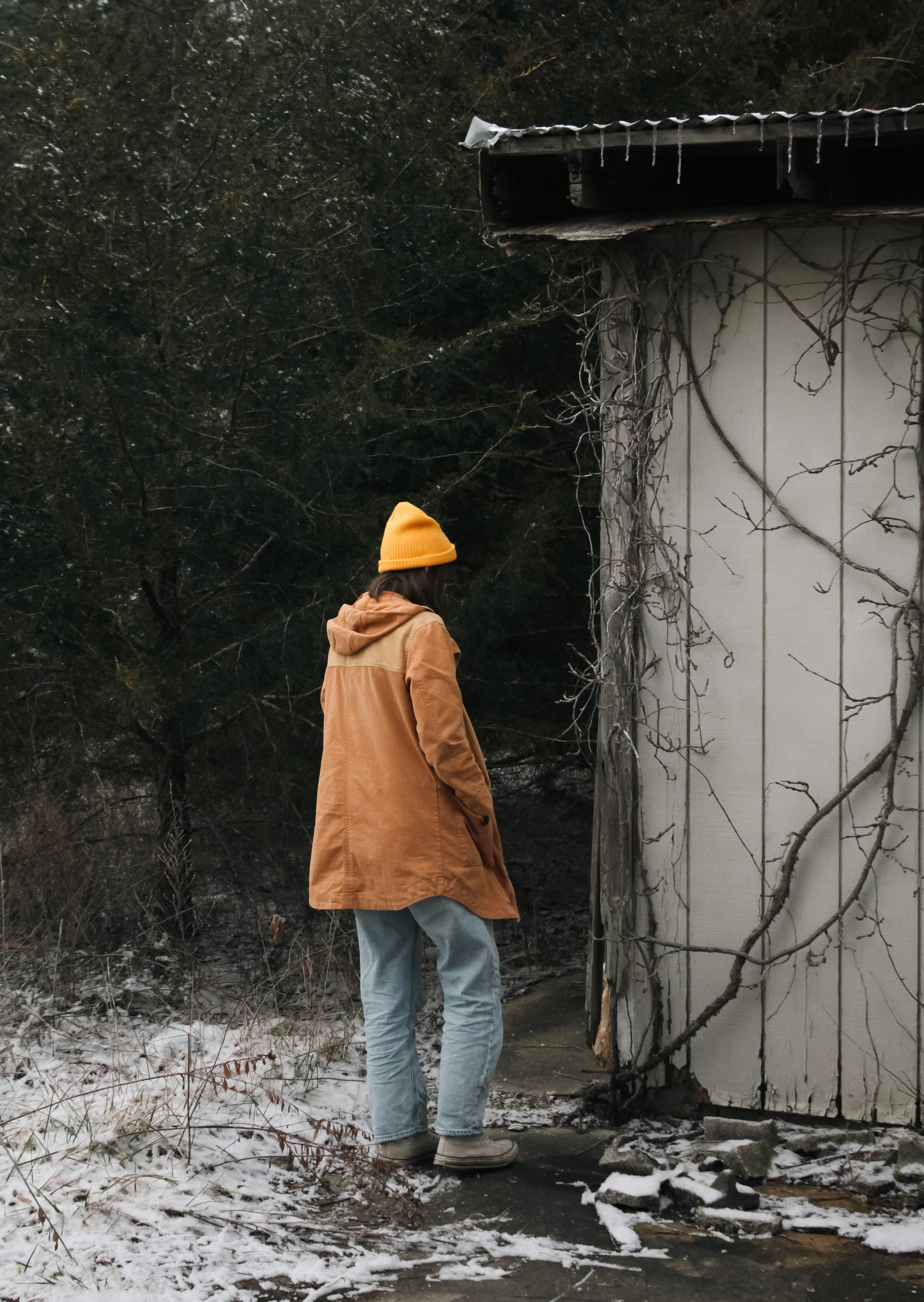 a person standing next to a water fountain