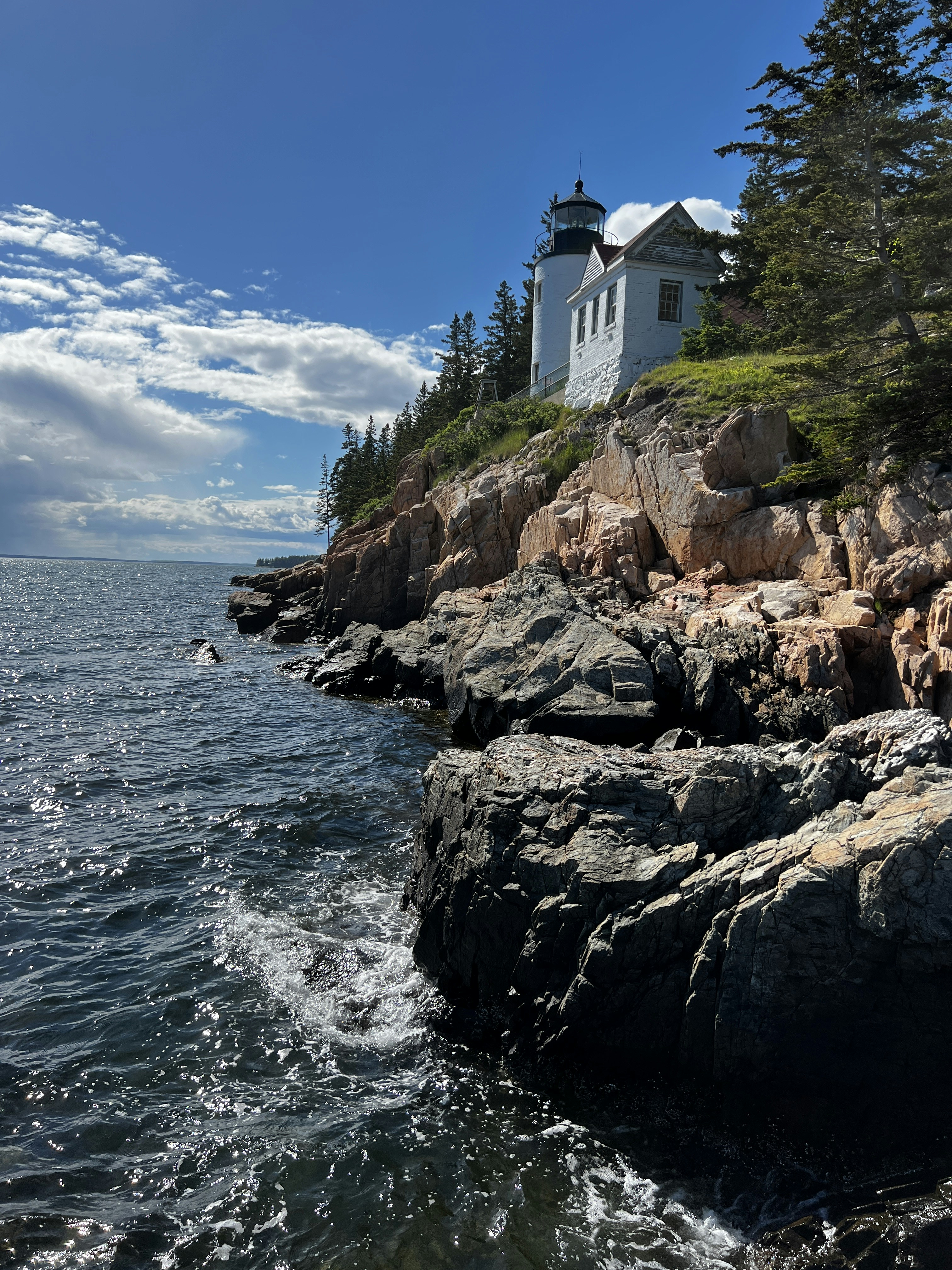 Lighthouse on Granite Edge: A Coastal Beacon Above Crashing Seas