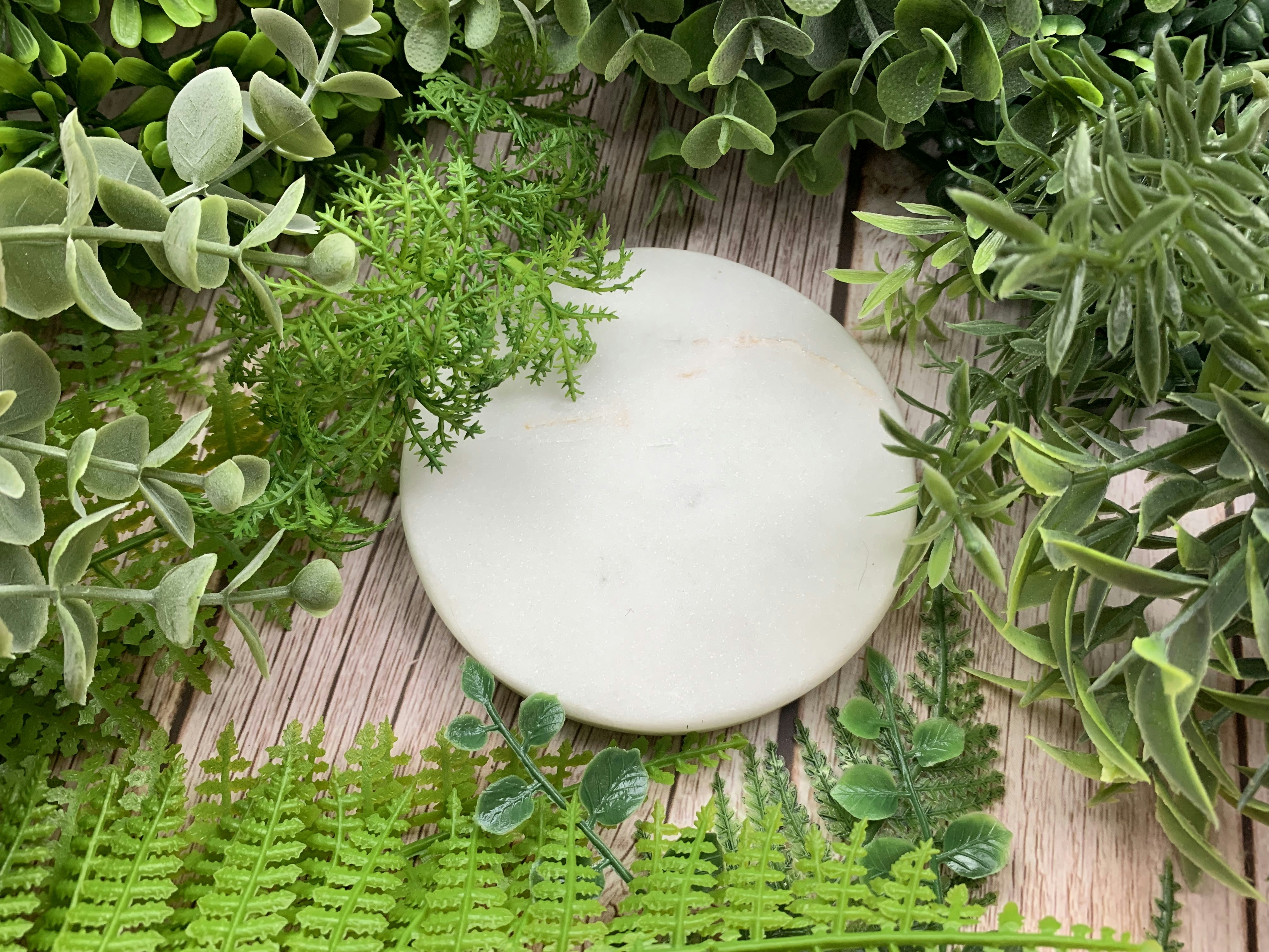 a white egg on a wooden surface