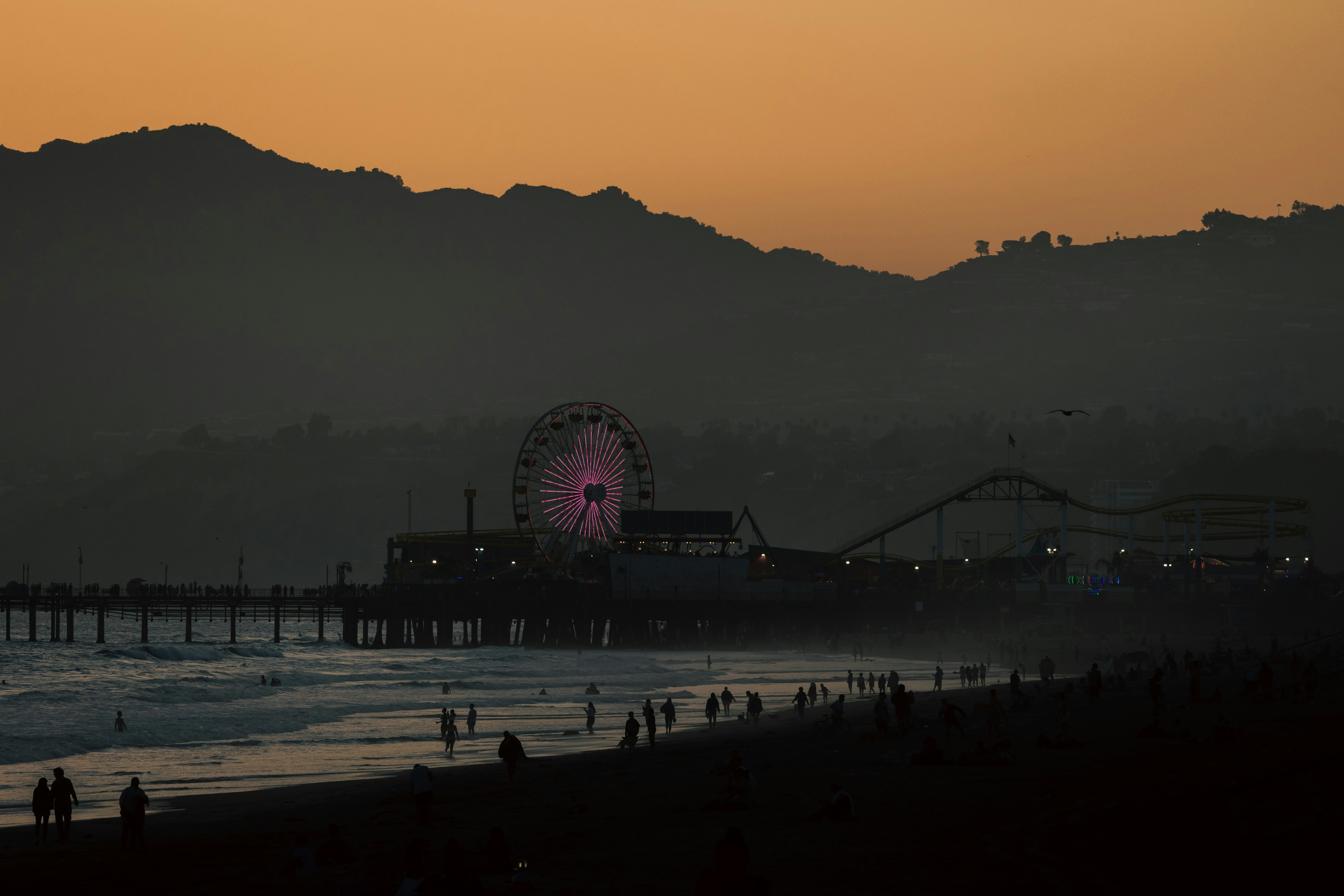 Dusk Wheel: Neon Ferris Glow Over a Pier