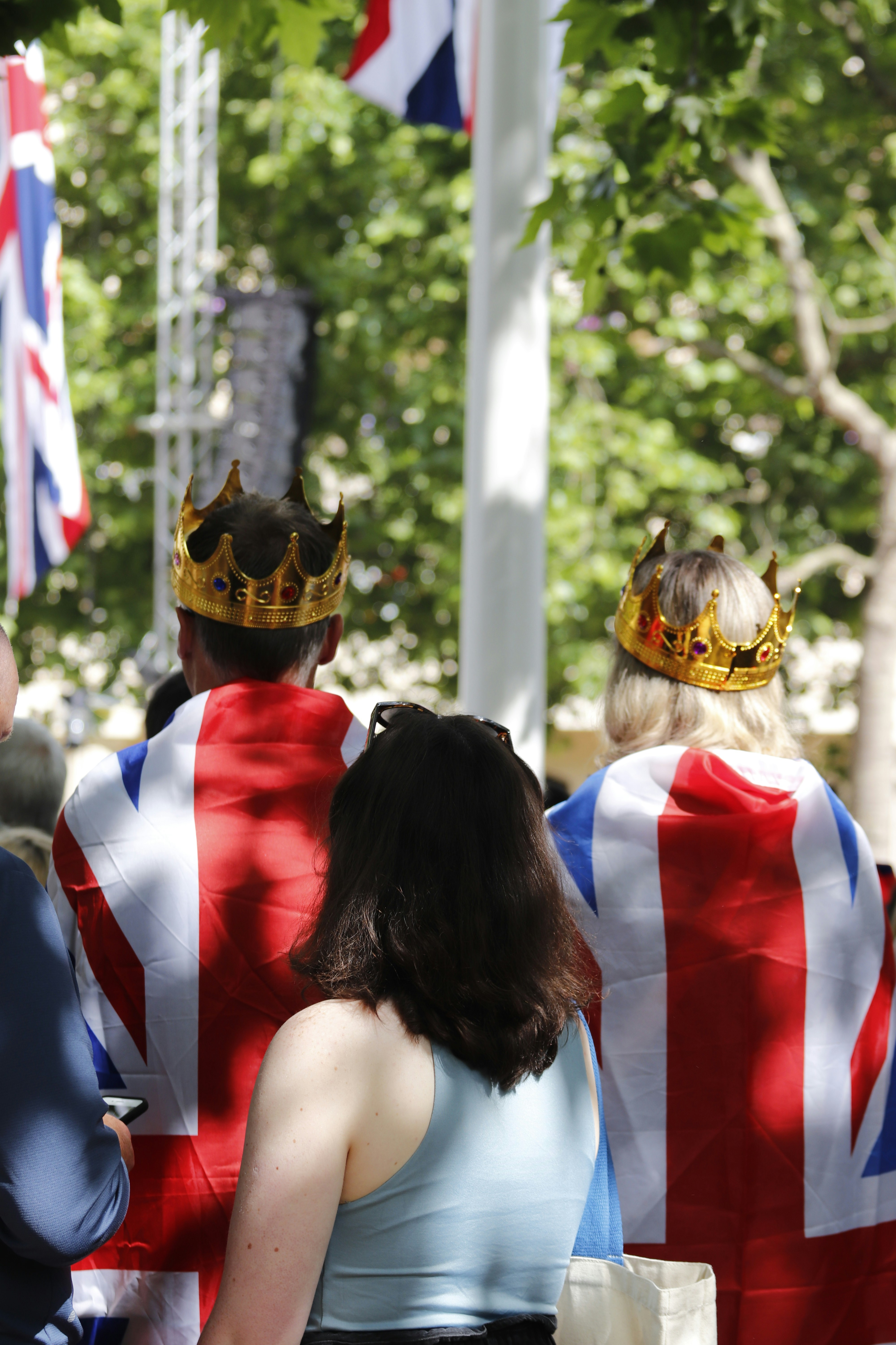 Crowned in the Union Jack: A Sunlit Moment from Behind
