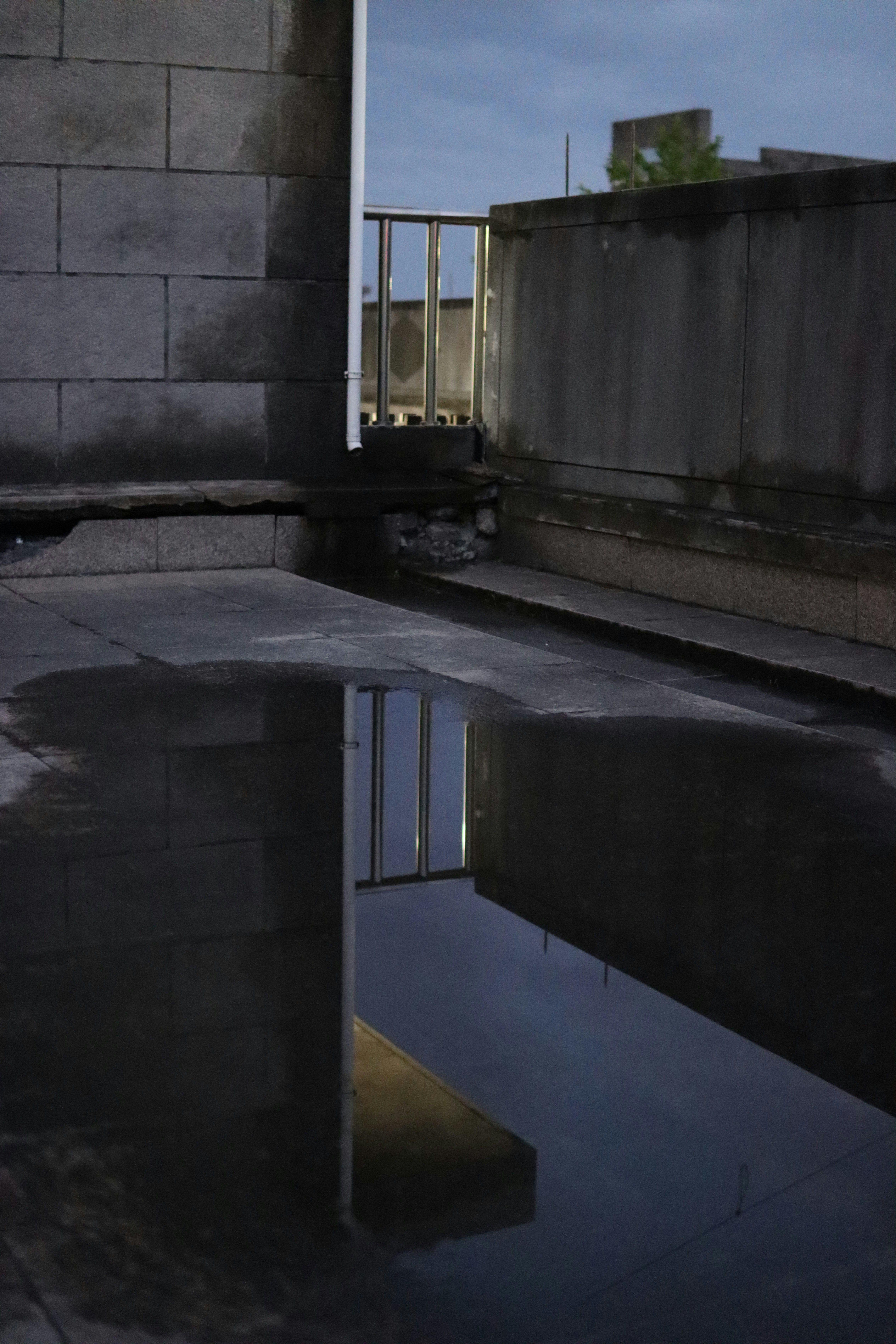 Rooftop Reflections: Quiet Geometry on a Rainy Terrace