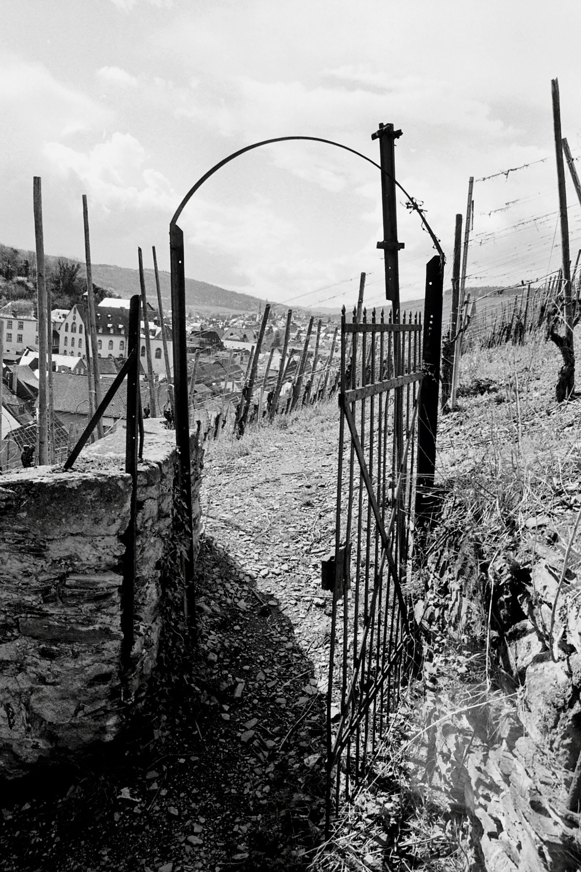A fenced off area with a pipe going through it photo – Free Ilford hp5 ...