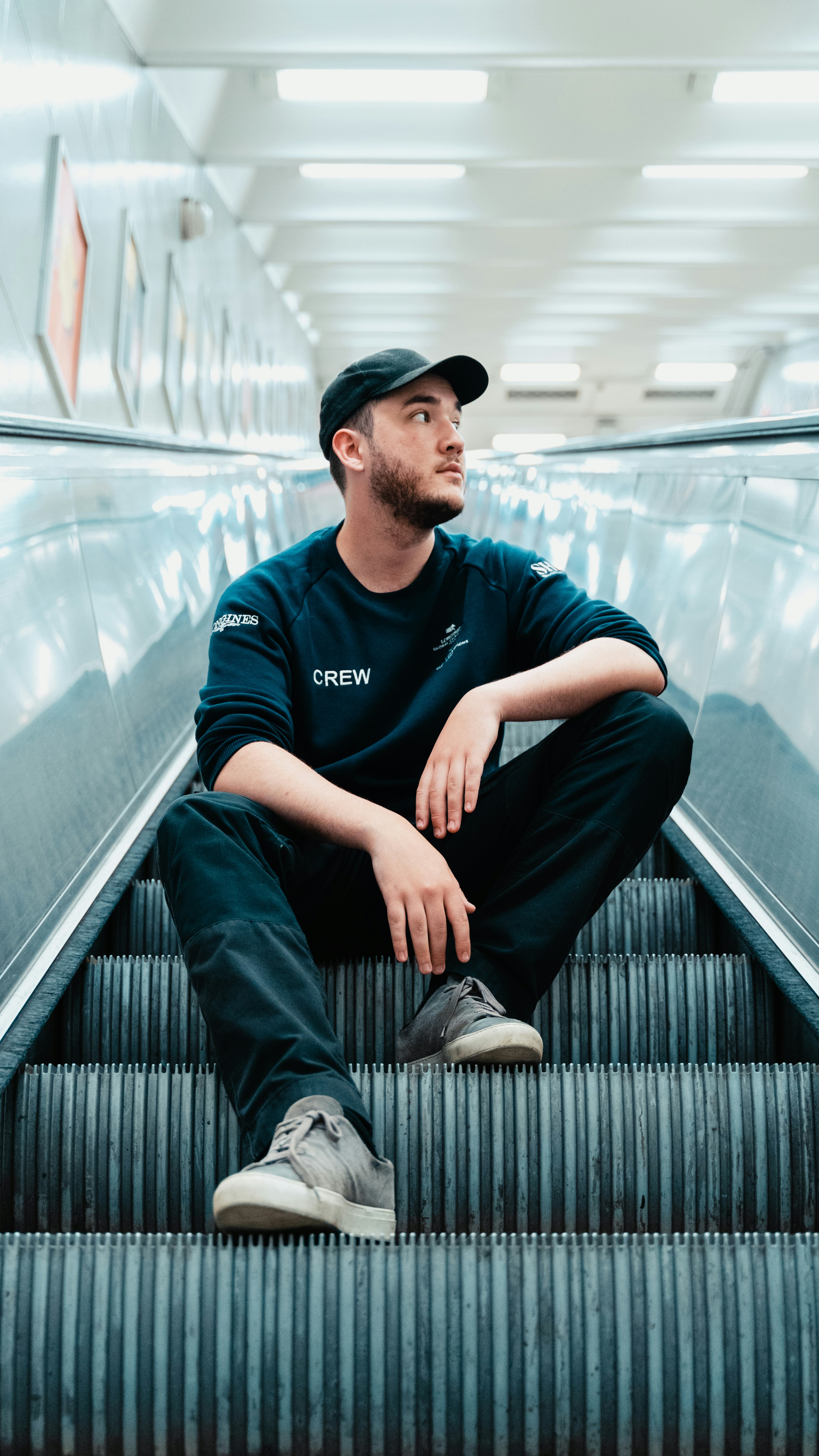 Crewman on an Escalator: Quiet Confidence in Transit