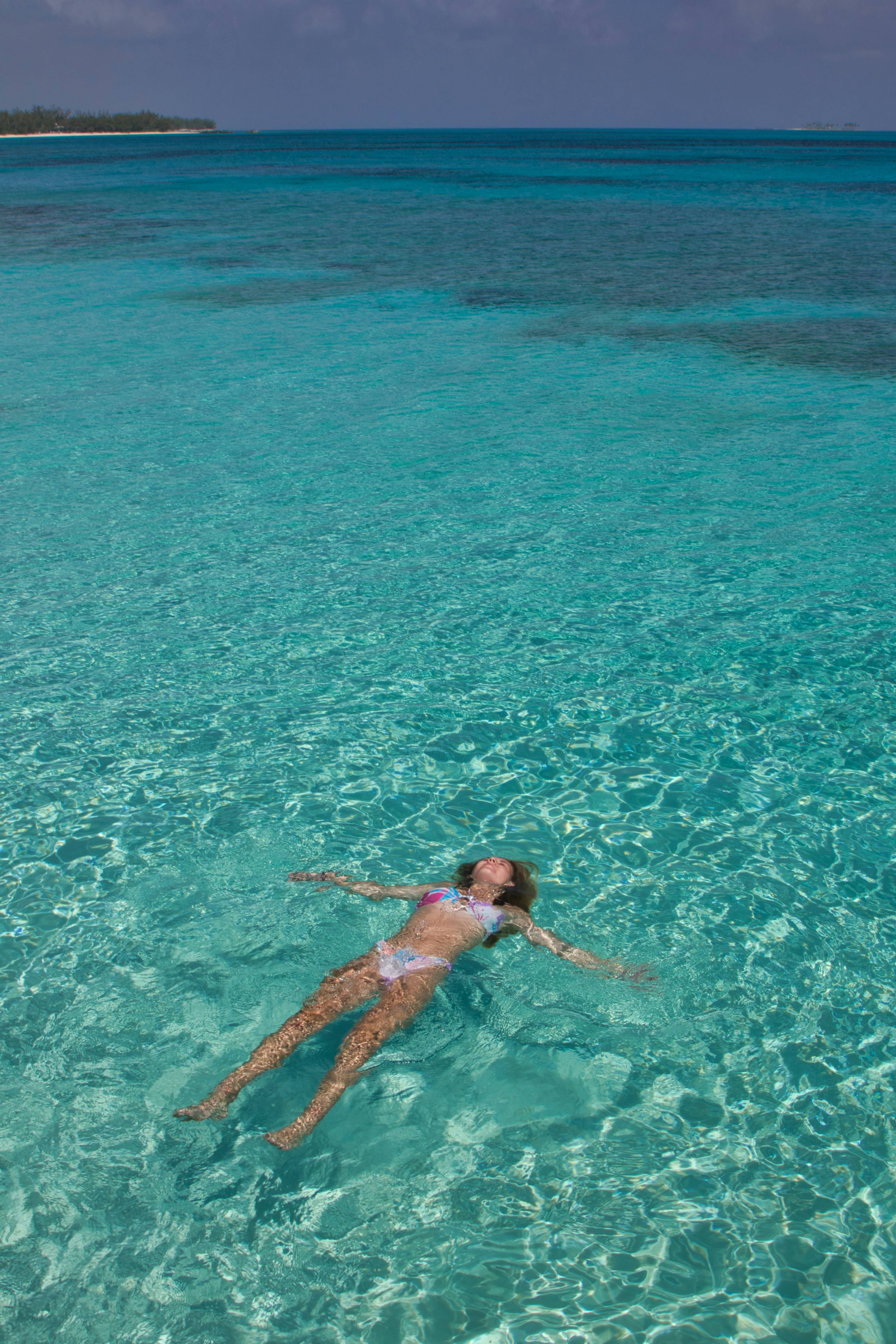 Drifting in Carib-Blue: A Woman Floats on Crystal-Clear Waters