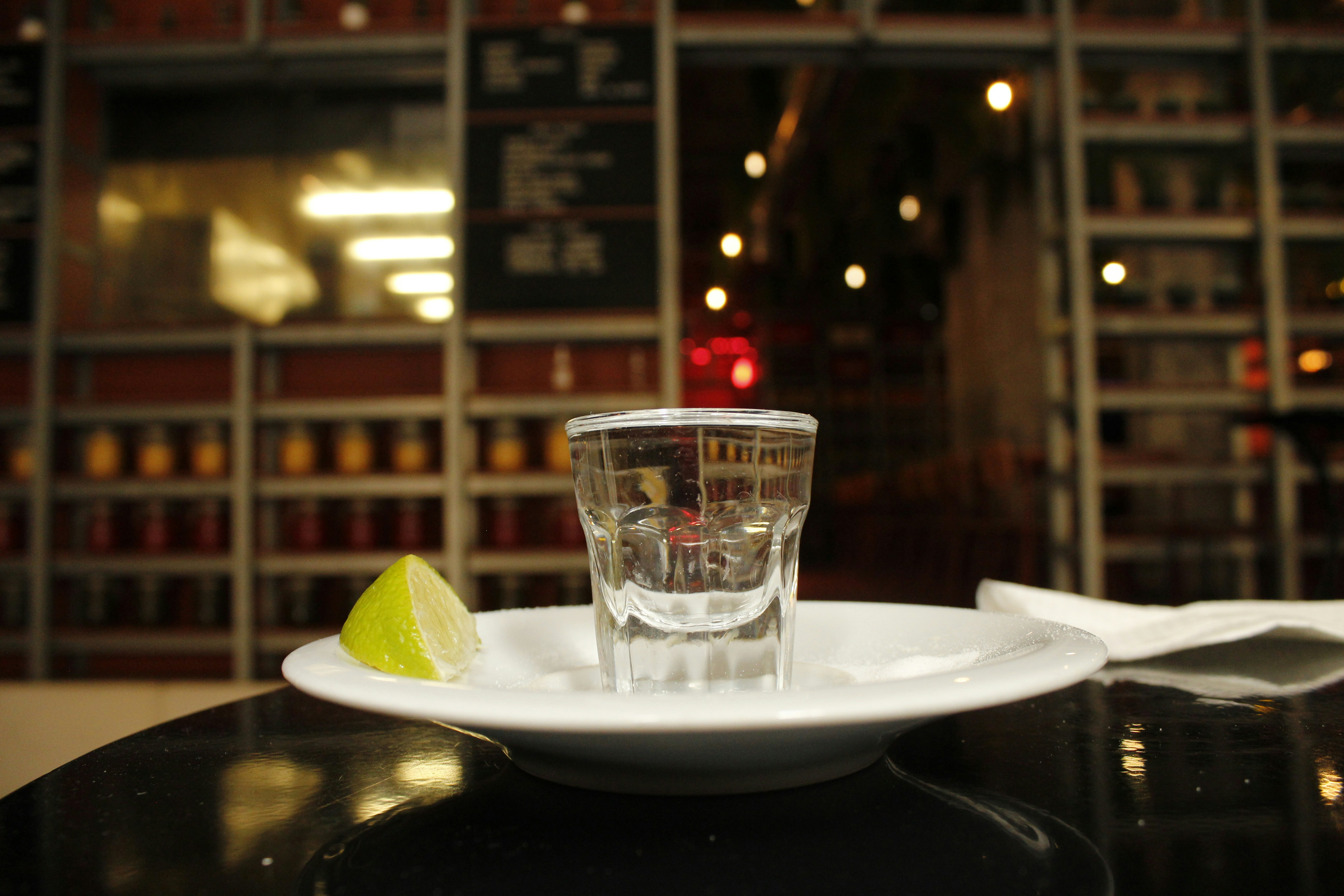 Midnight Shot: Single Shot Glass on a Dark Counter