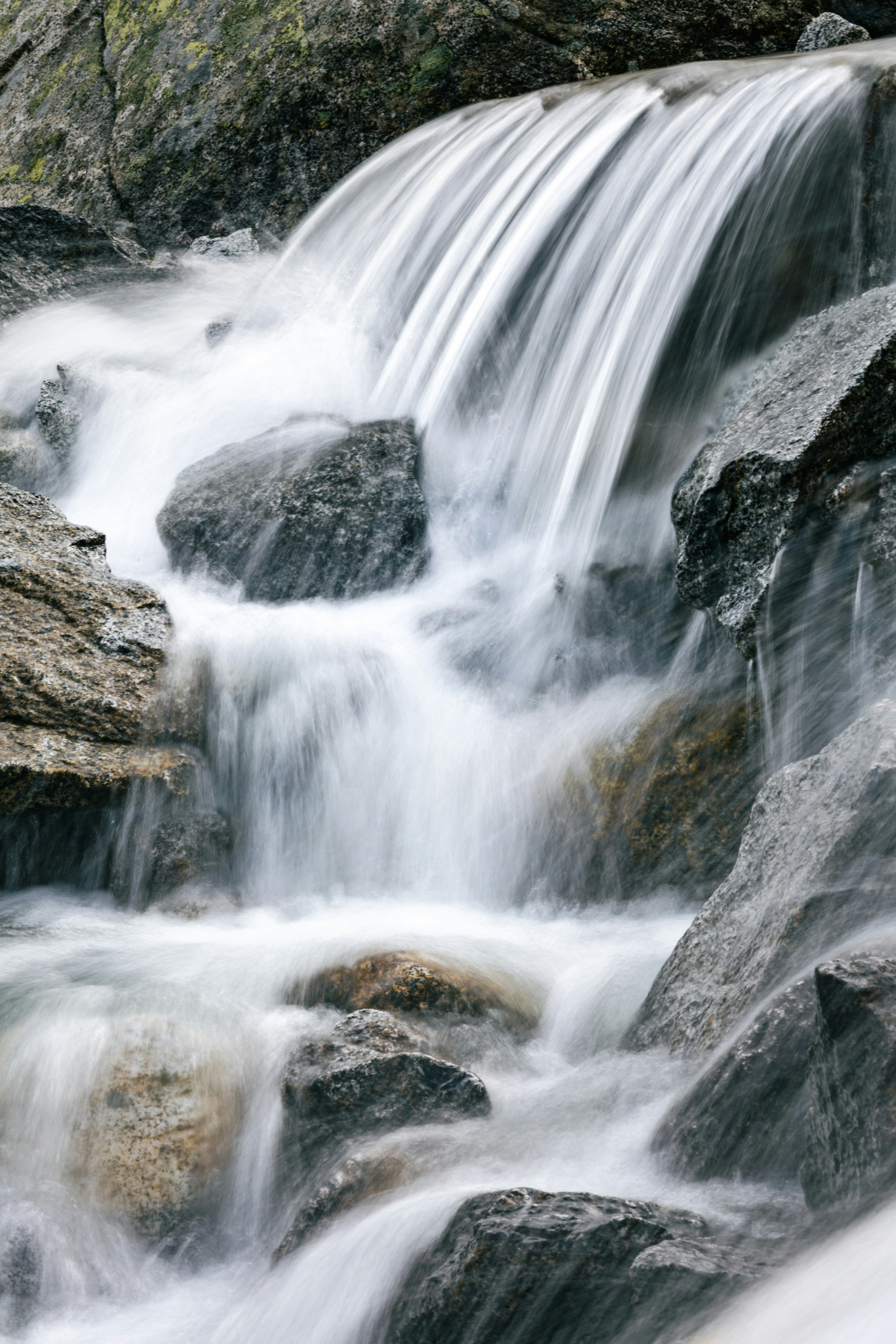 A waterfall with rocks photo – Free Nature Image on Unsplash