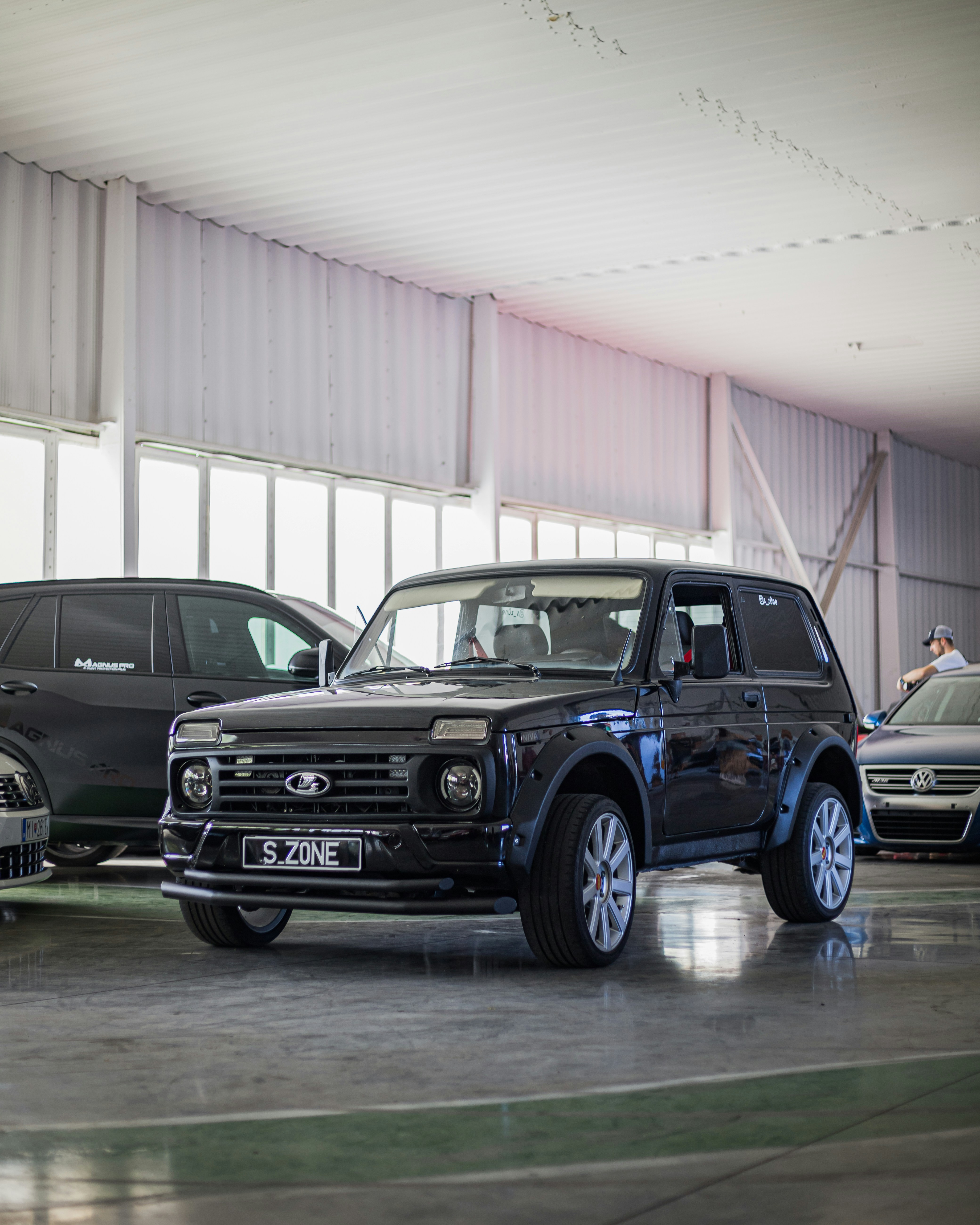 Midnight Classic: A Lada 4x4 Resting in an Illuminated Showroom