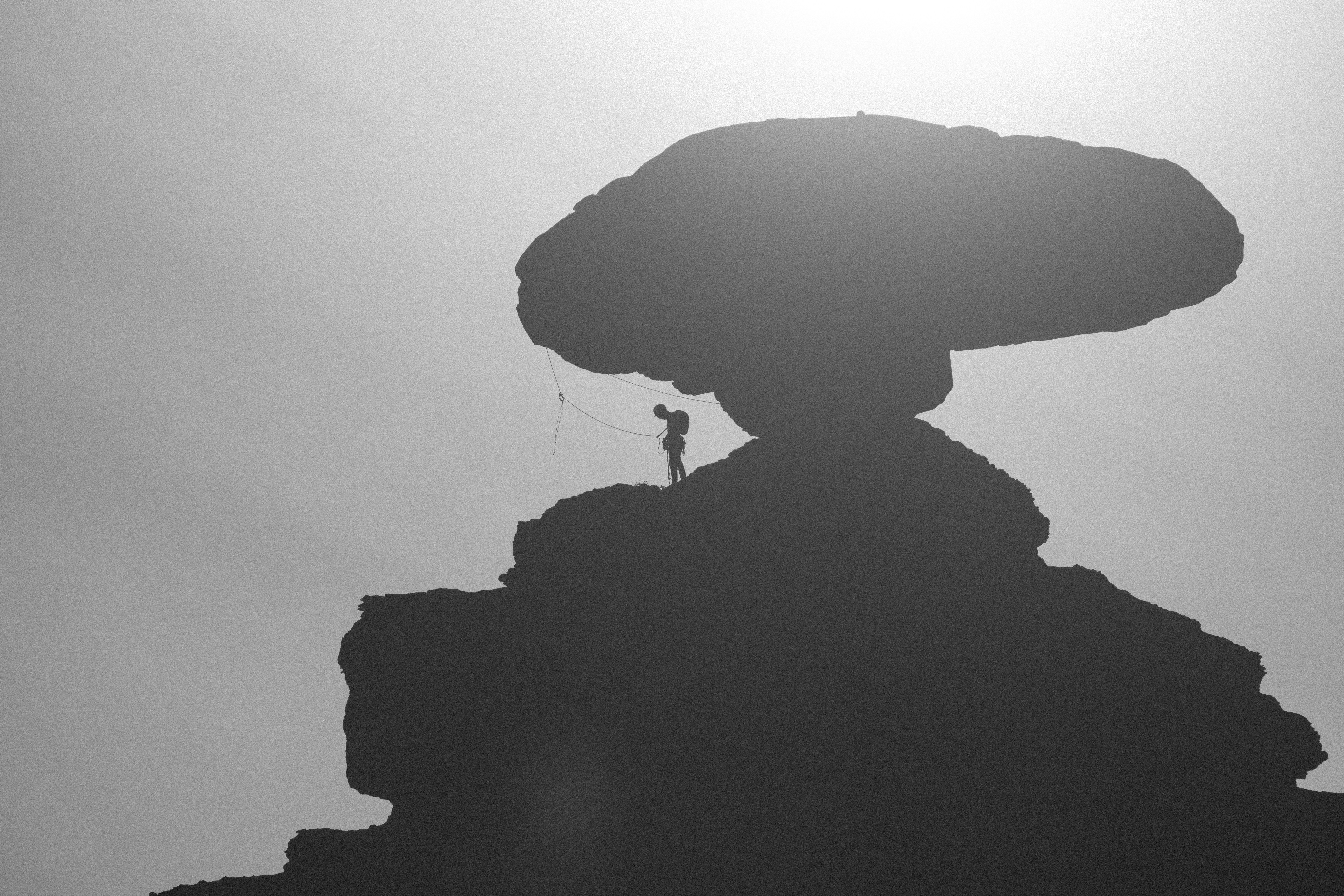 a person standing on a rock