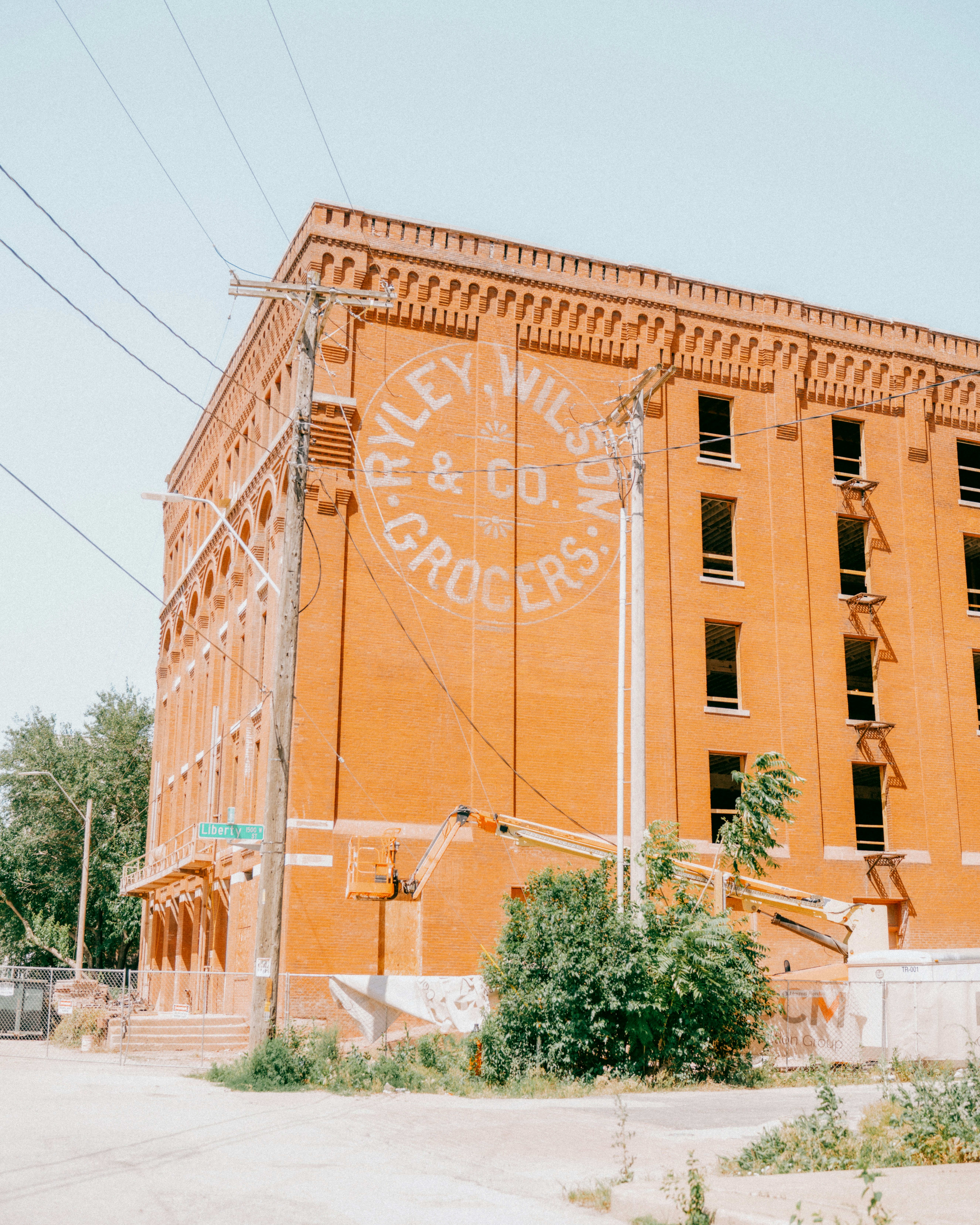 Circle Crest on a Sunlit Brick Warehouse