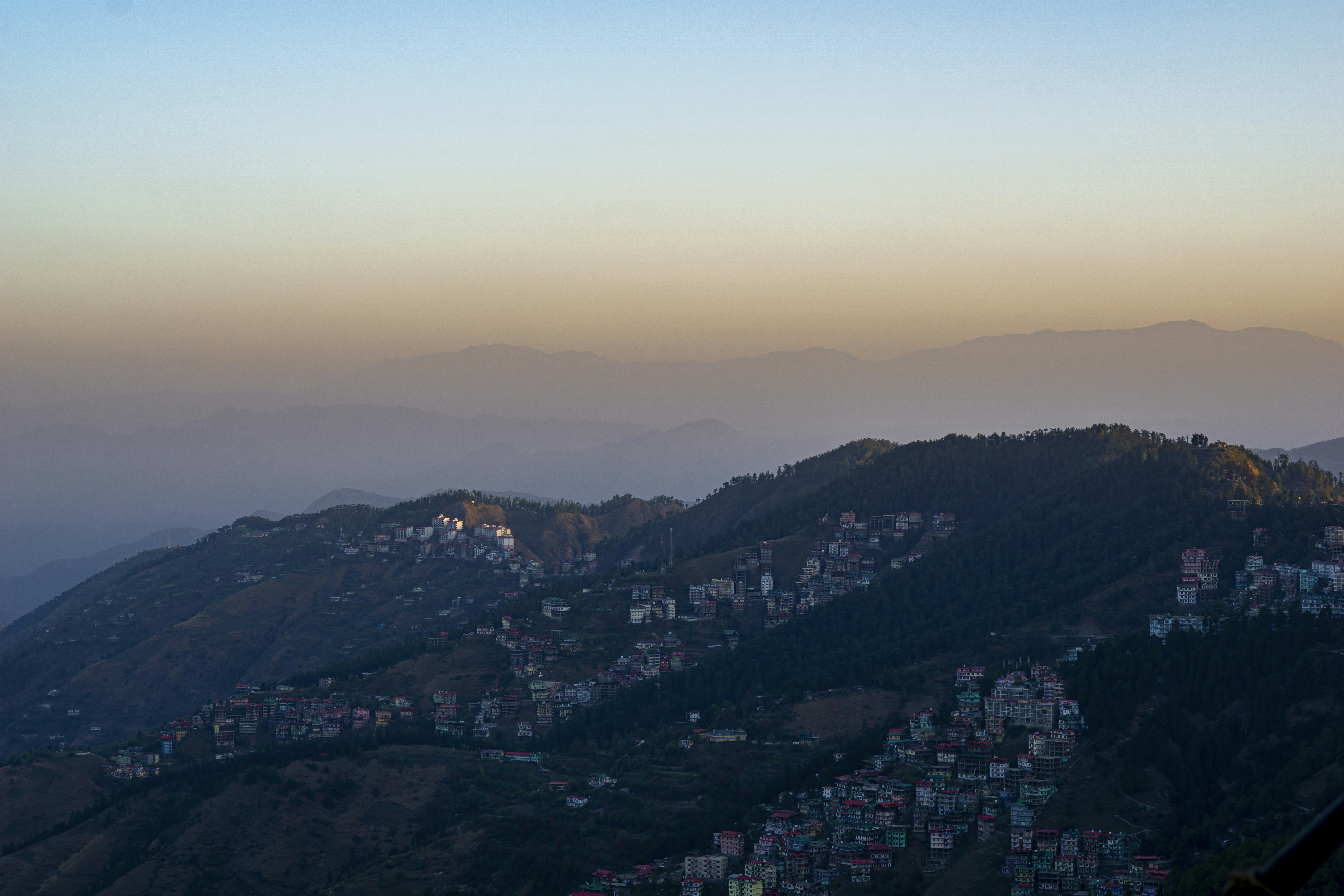 Dawn Mist Over a Terraced Mountain Village