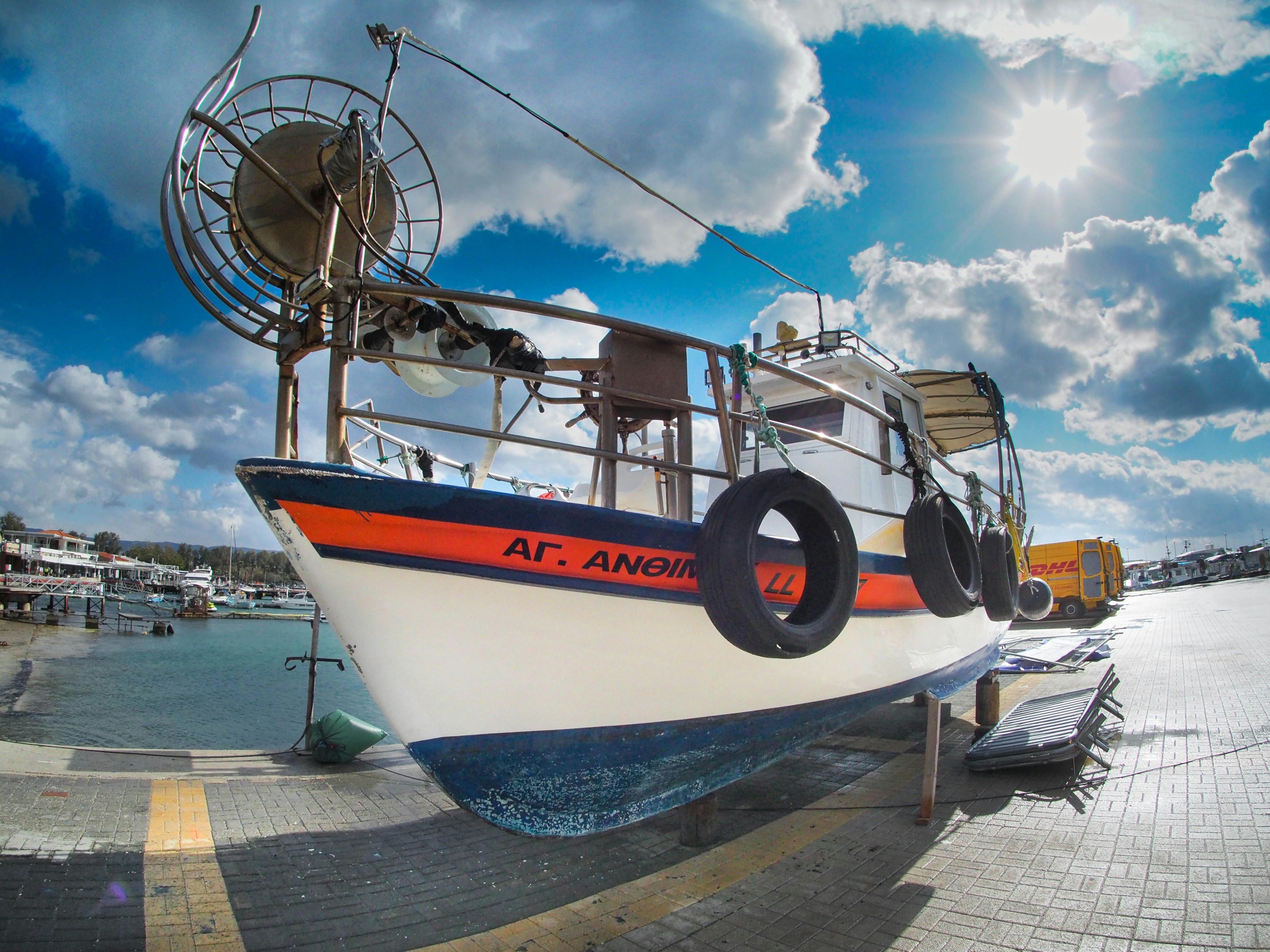 Harbor Vessel Anchored in a Sunlit Waterfront Canvas