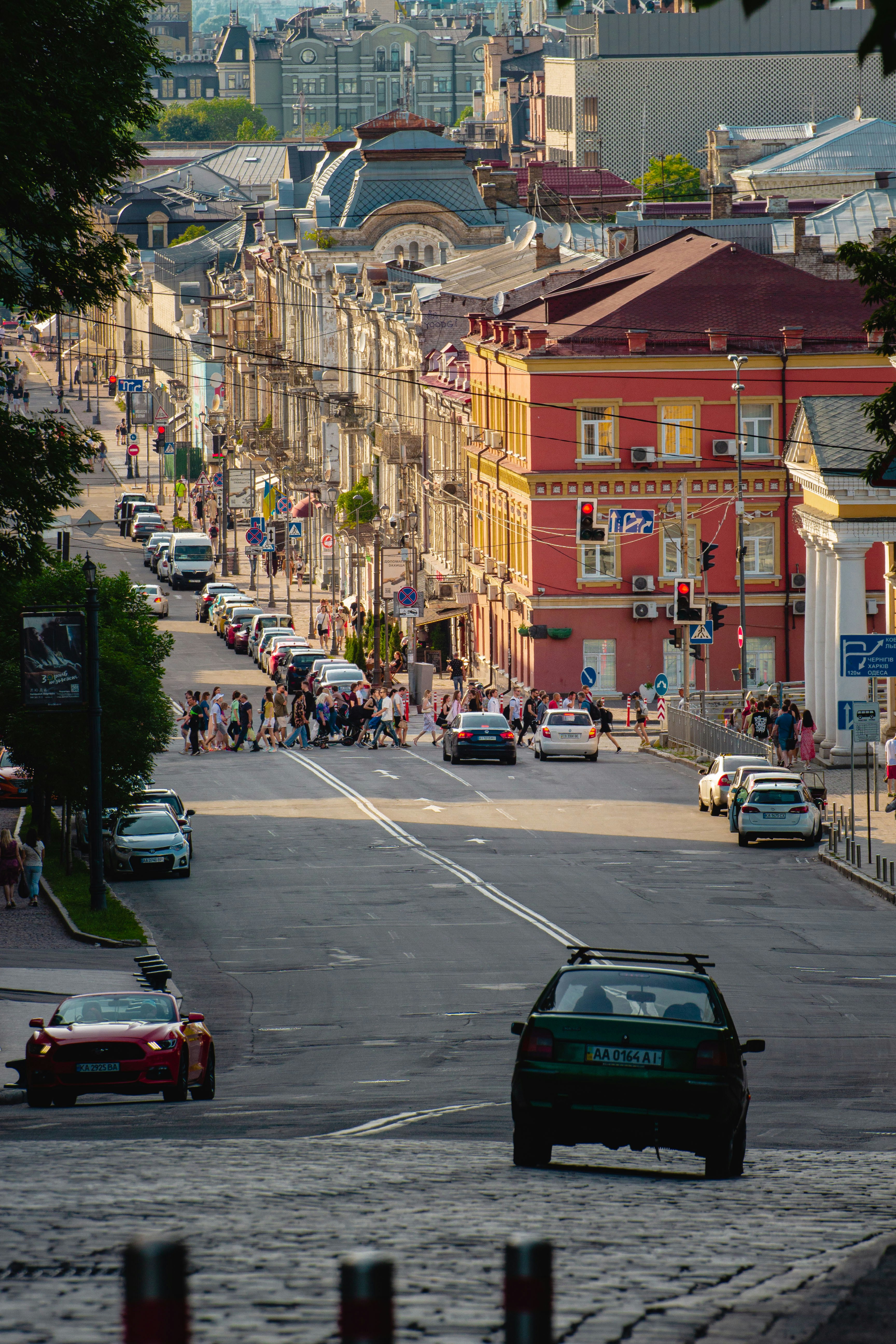 a busy street with cars and people