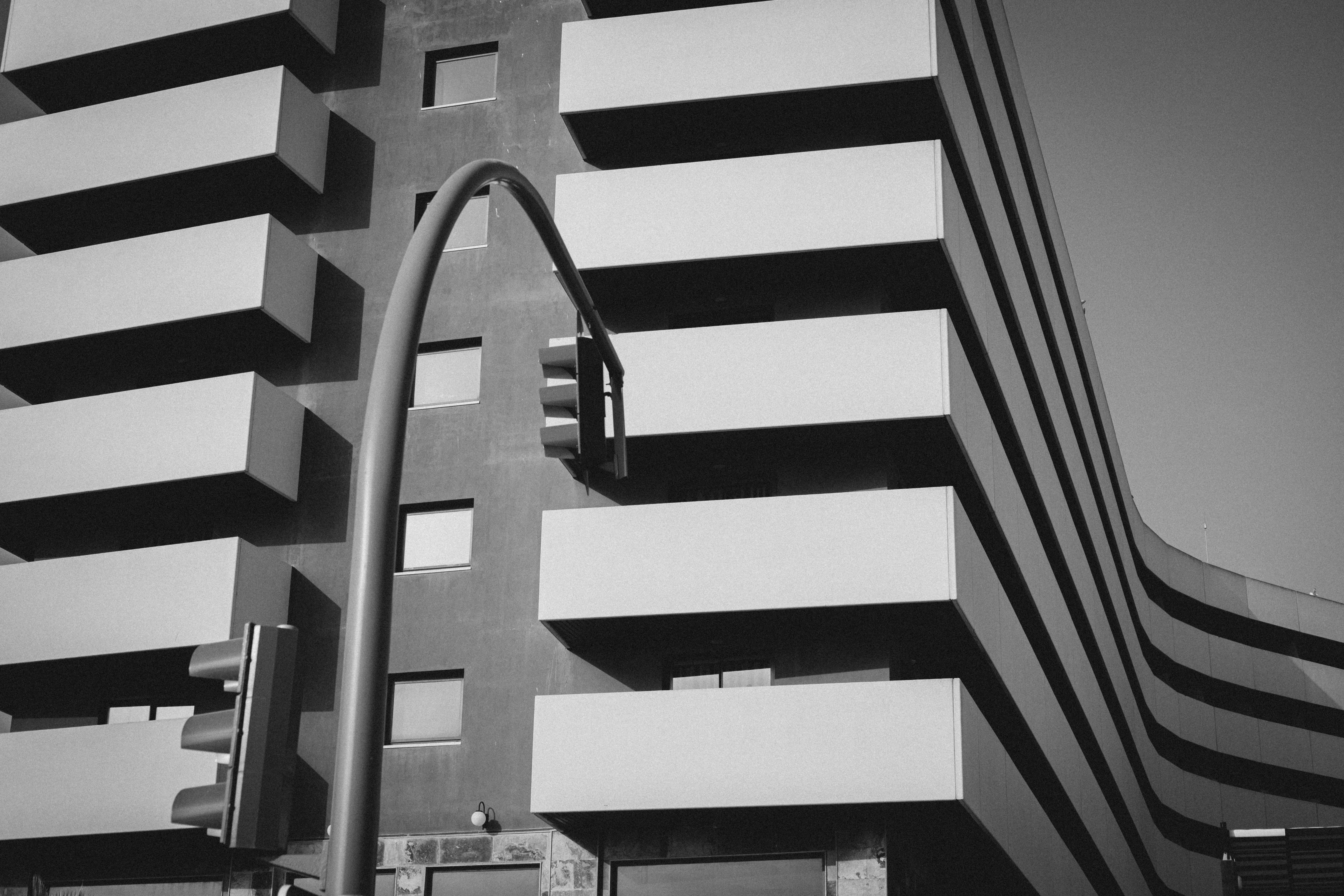 Urban Geometry: Monochrome Facade with Recessed Shadows