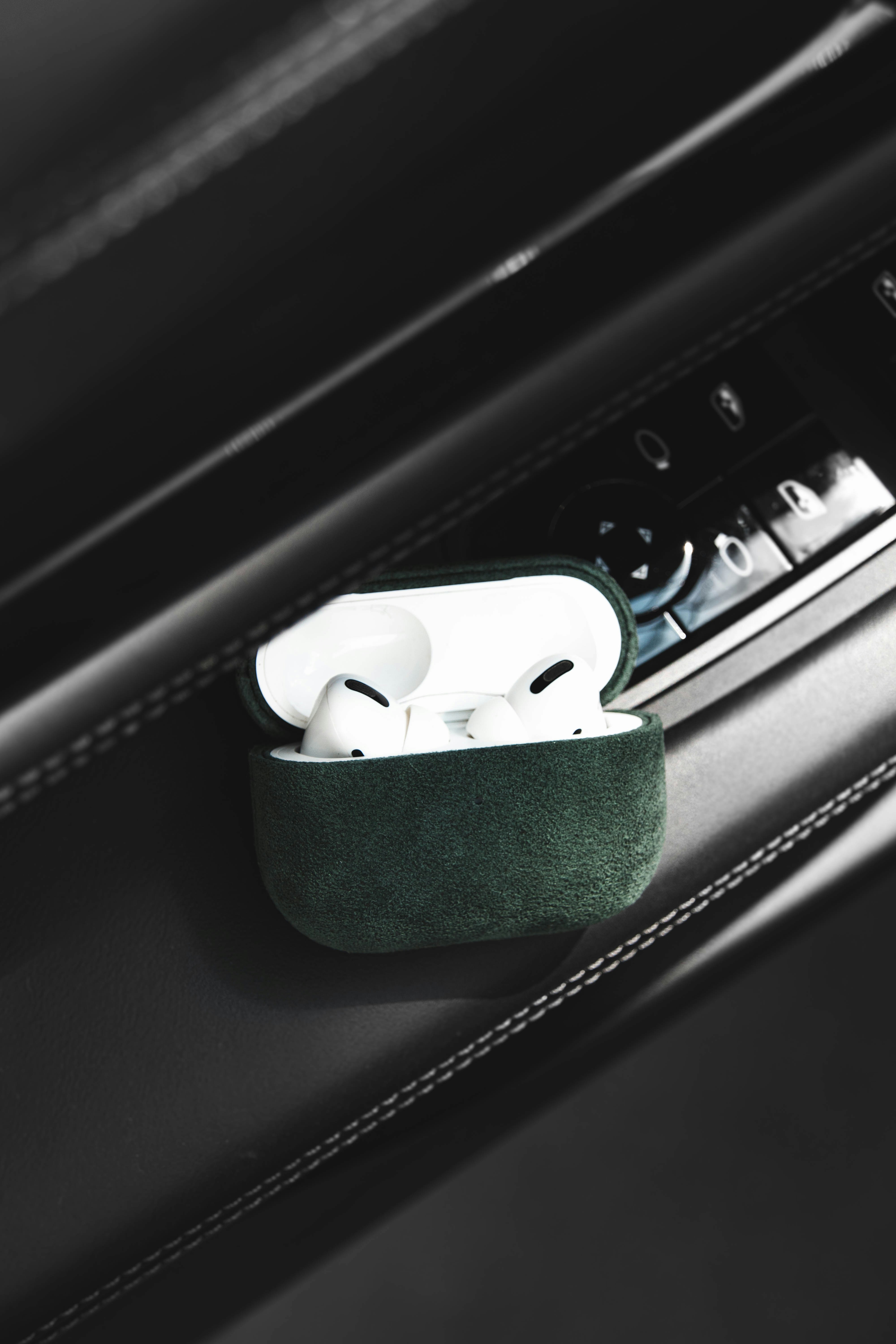 AirPods Pro in a Green Velvet Pocket: Subtle Lux in a Car Interior