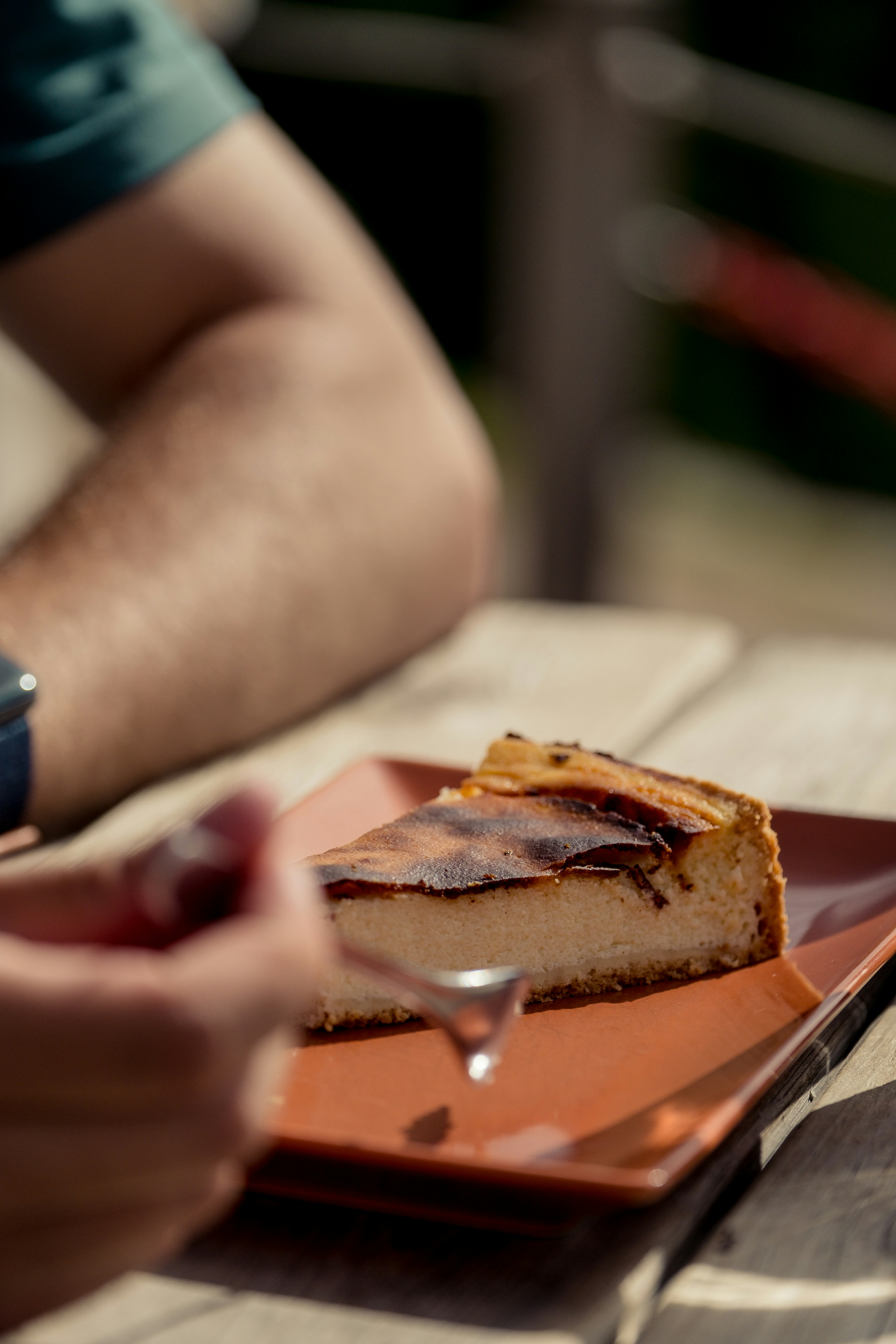 a person holding a piece of cake