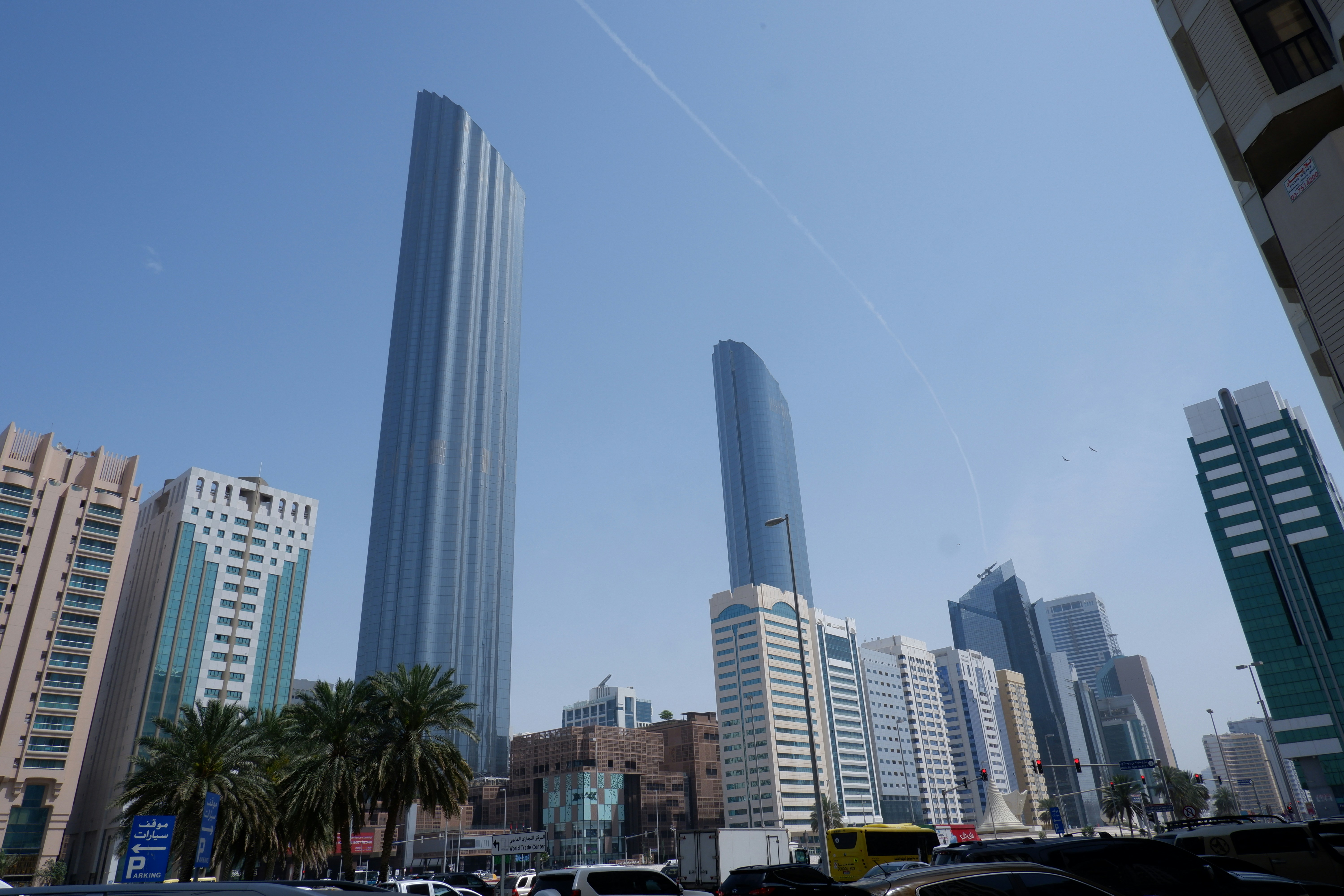 Skyline Symphony: Glass Towers Rise Over a Busy Coastal City