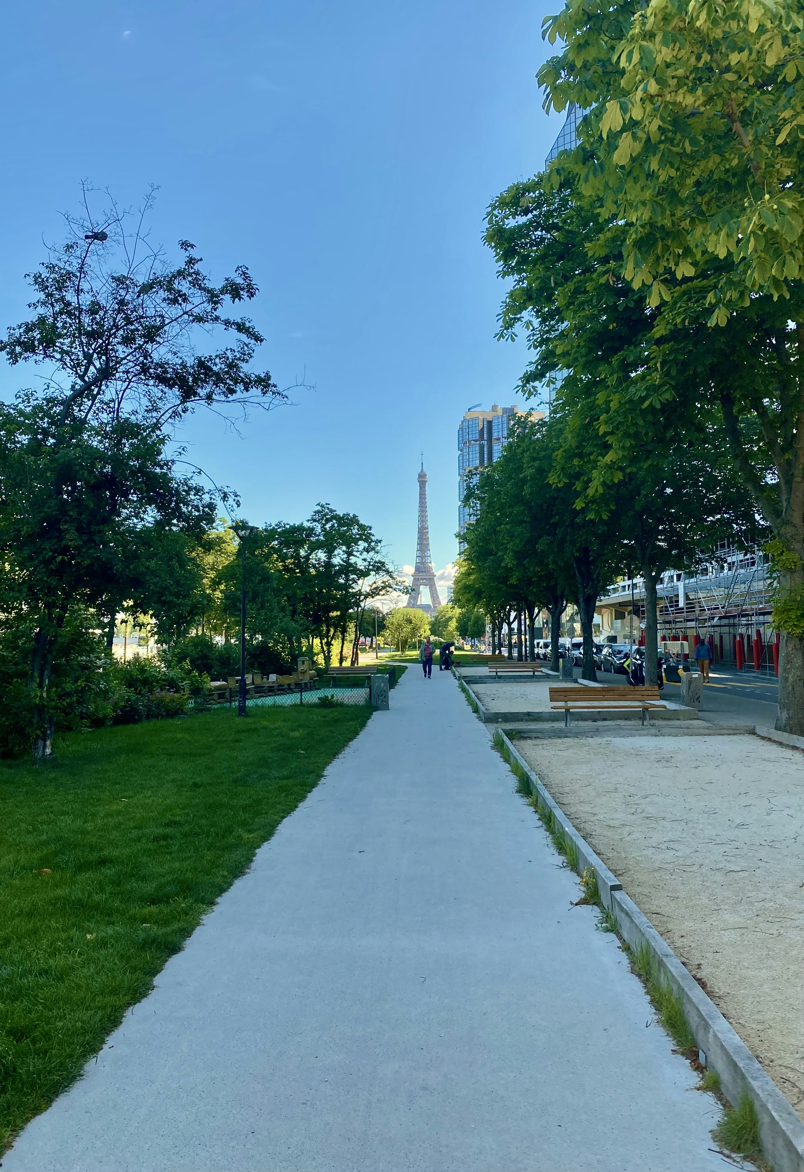 Path to the Eiffel Tower: A Parisian parkline under a clear sky
