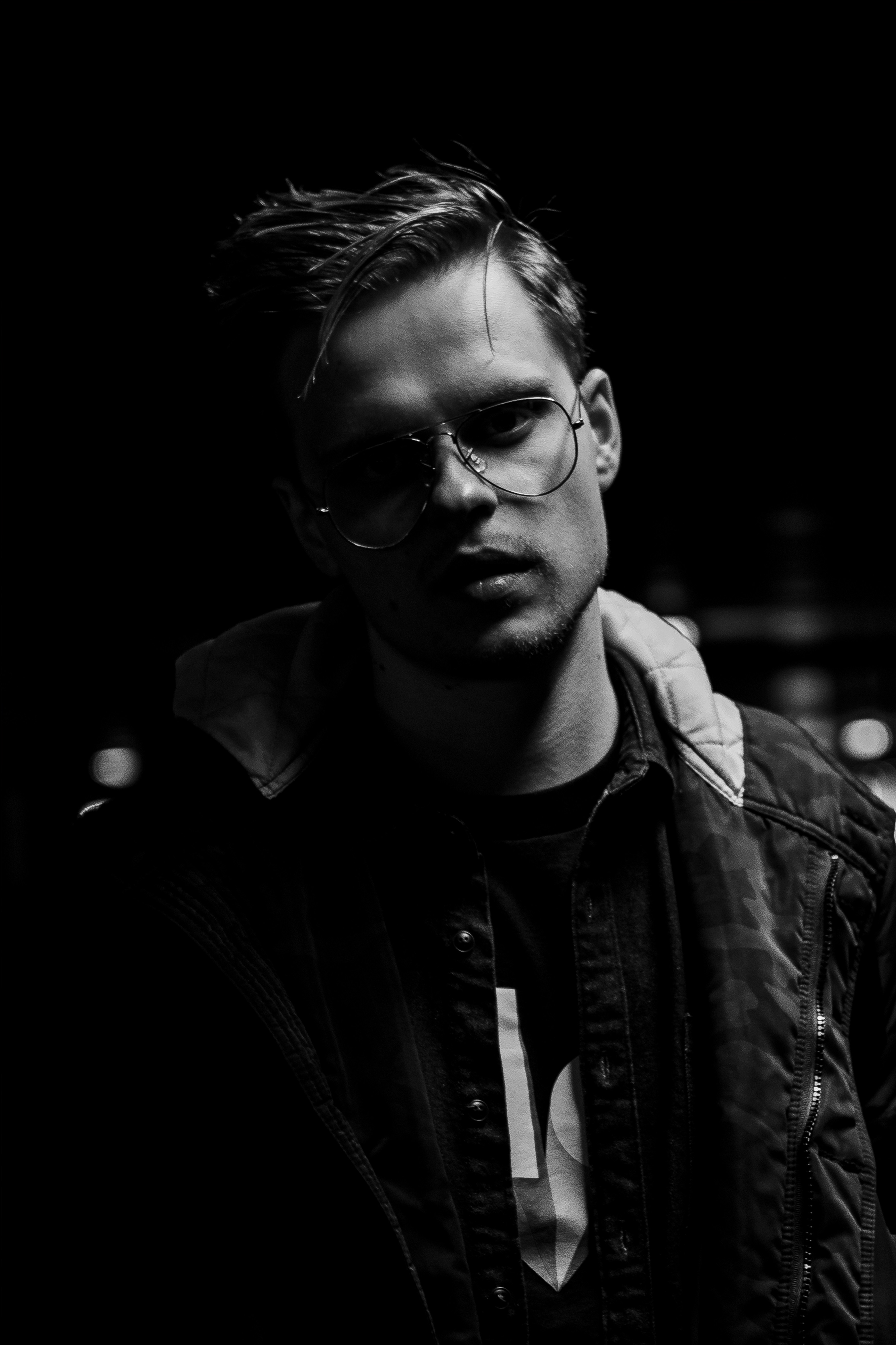 Noir Gaze Beneath a Streetlight: A Quiet Portrait