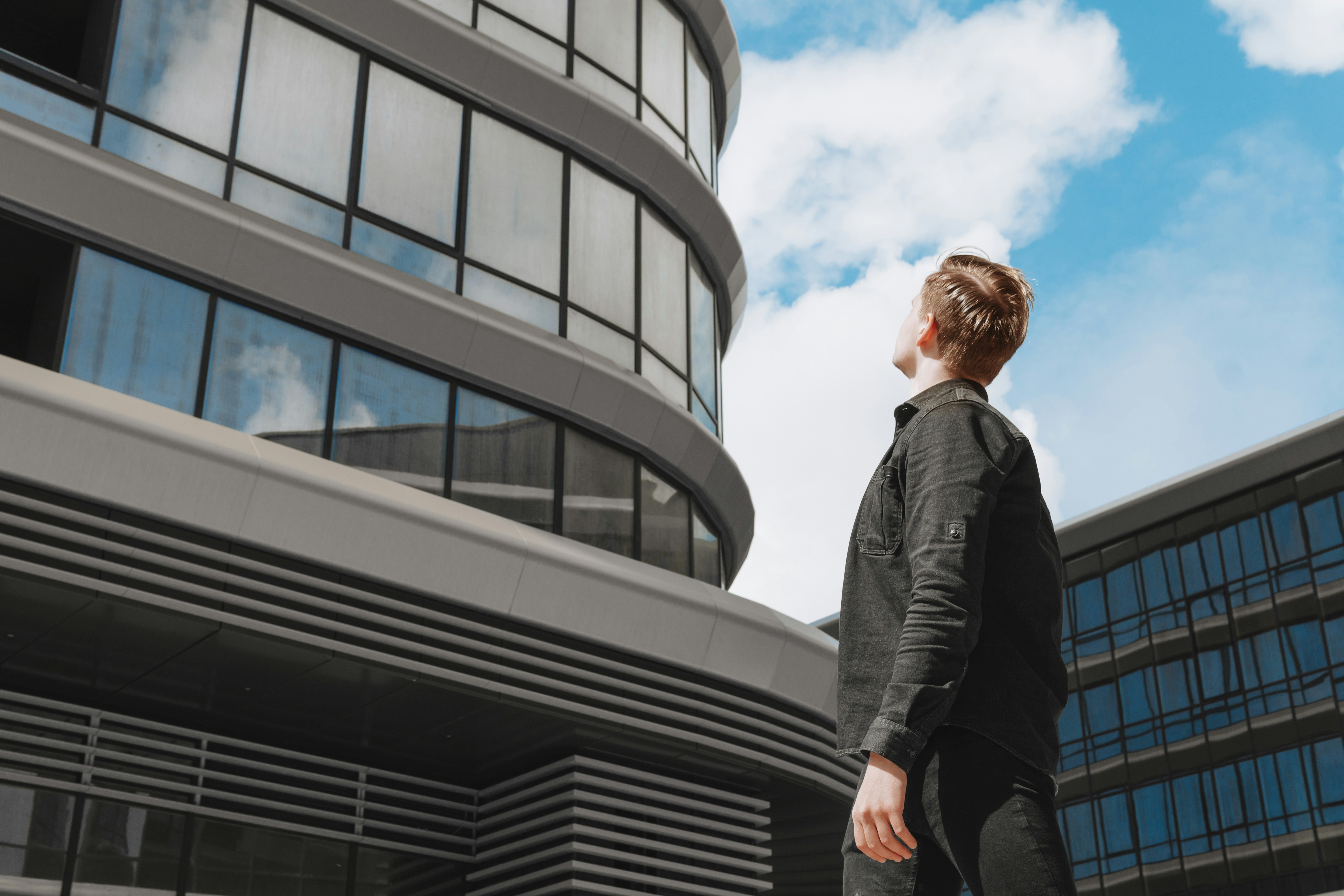 A man standing outside a building photo – Free Architecture design ...