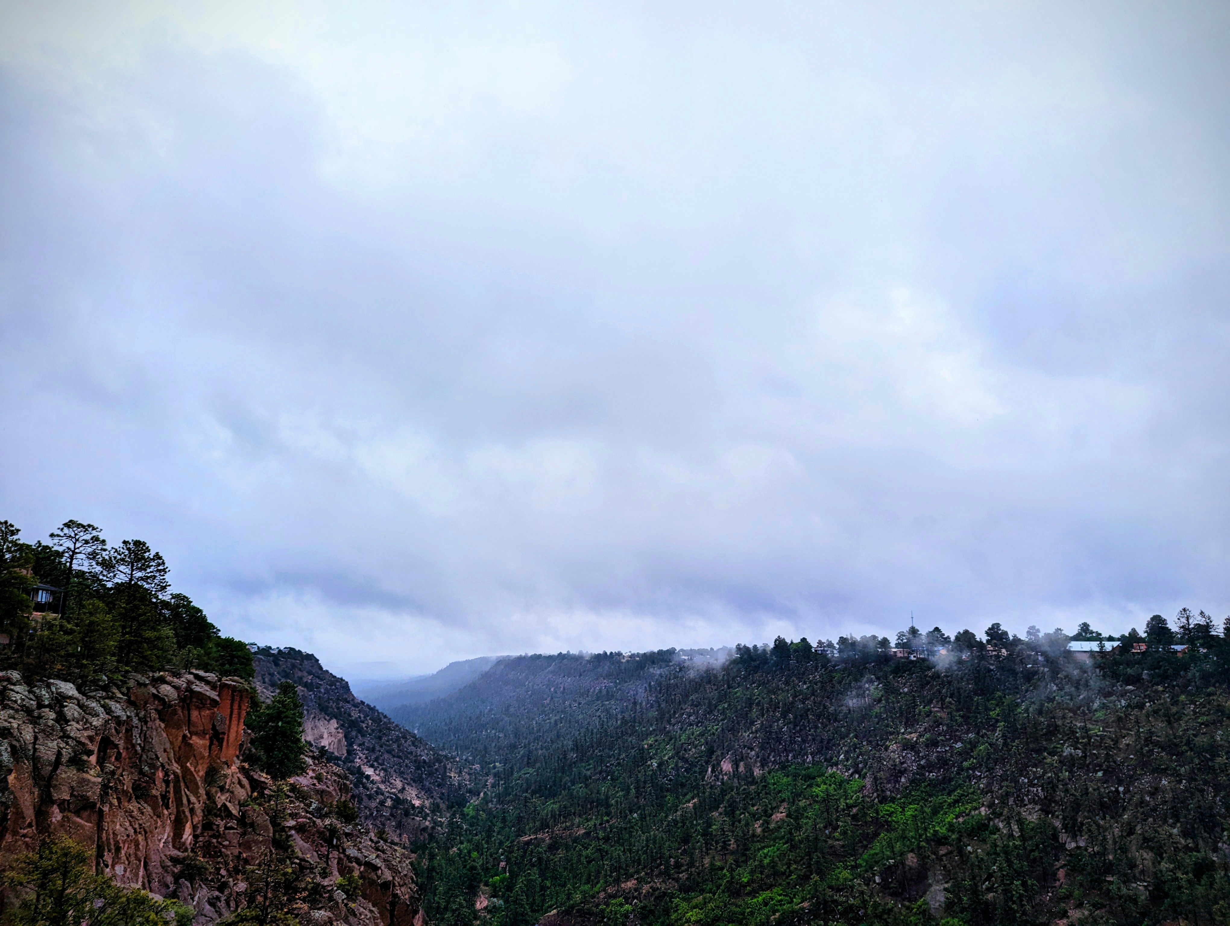 An endless canyon filled with stormy clouds.
