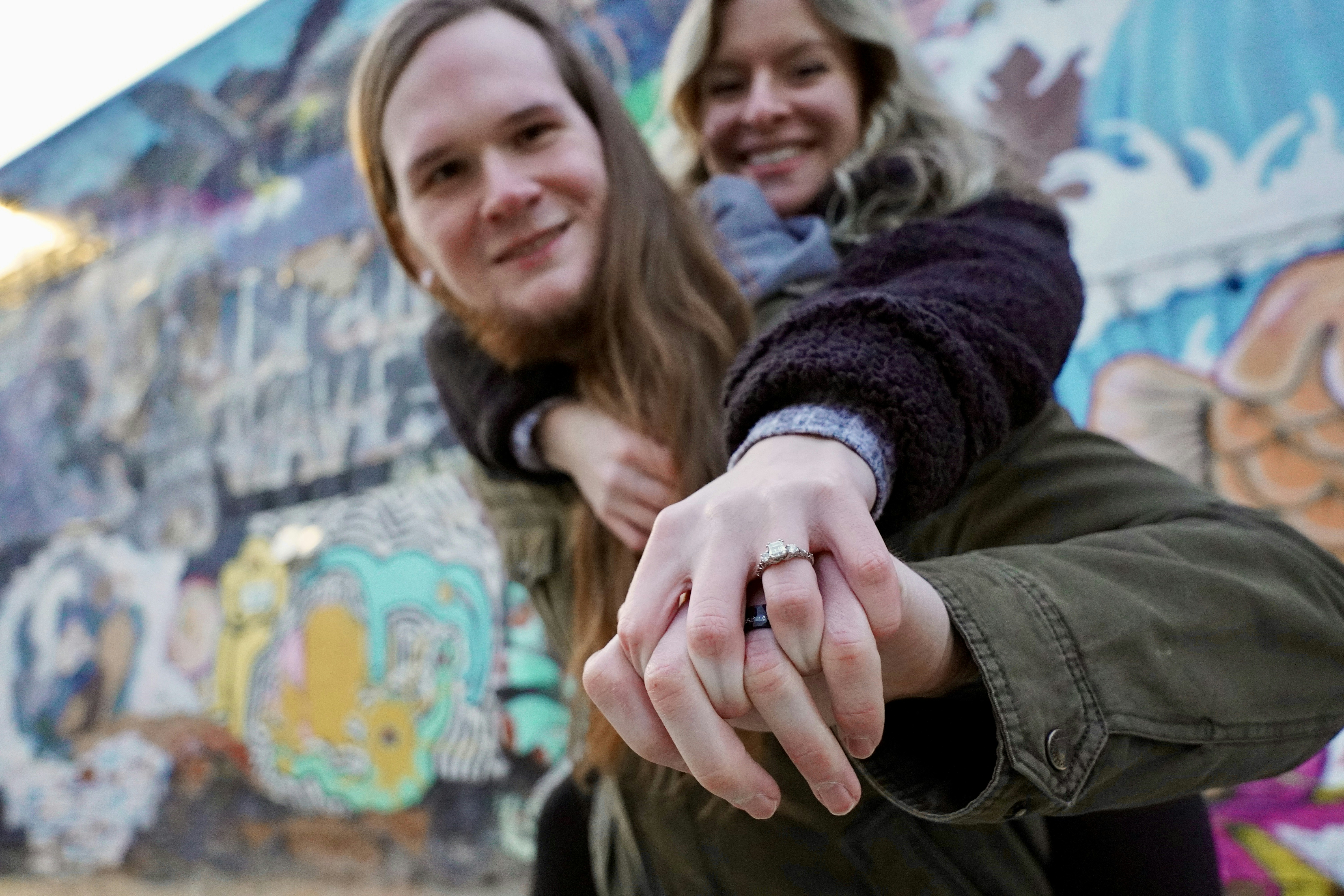 Close-Up Vibe: Hands Forward Against a Graffiti Backdrop