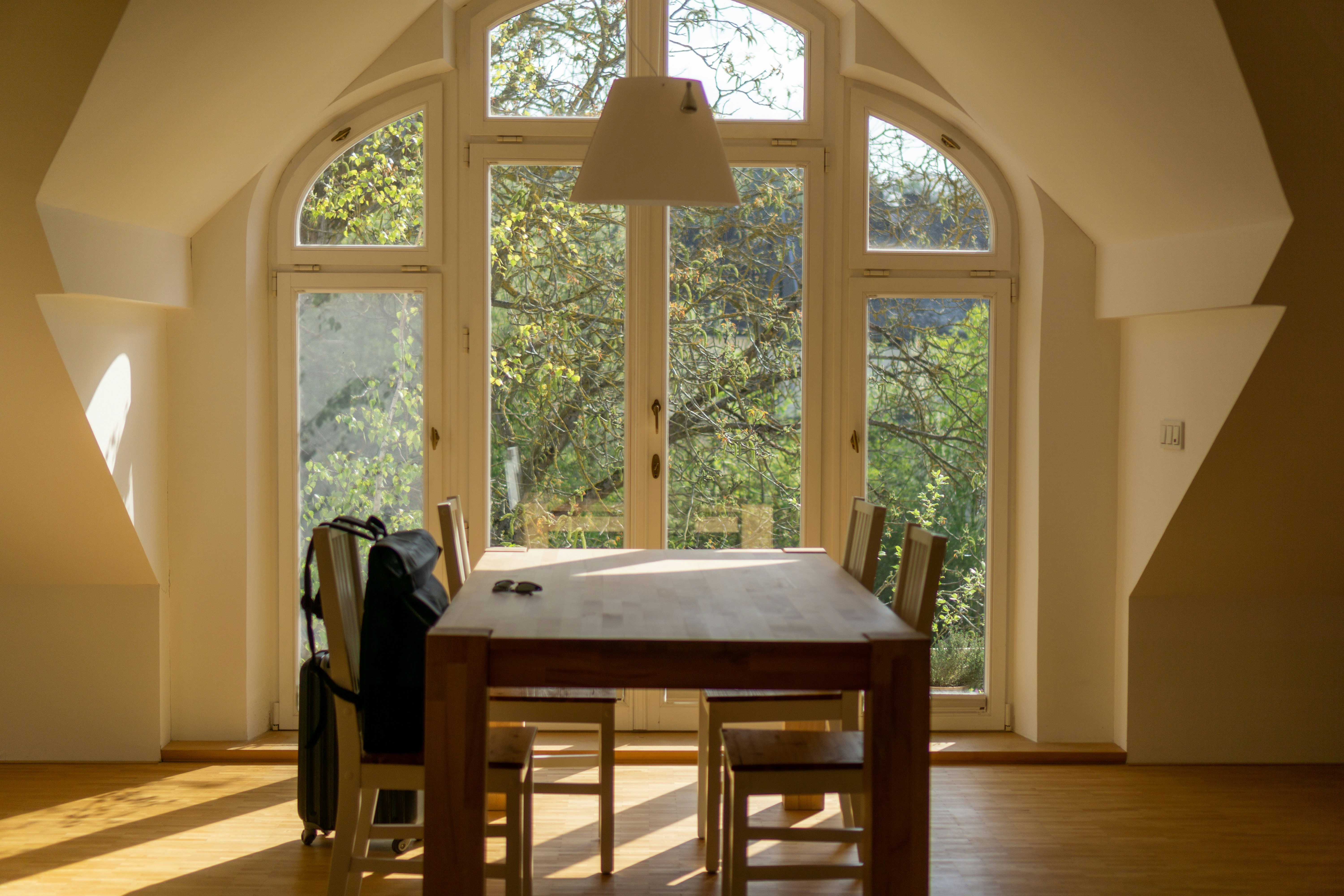 Sunlit Dining Nook Framed by Arched Windows
