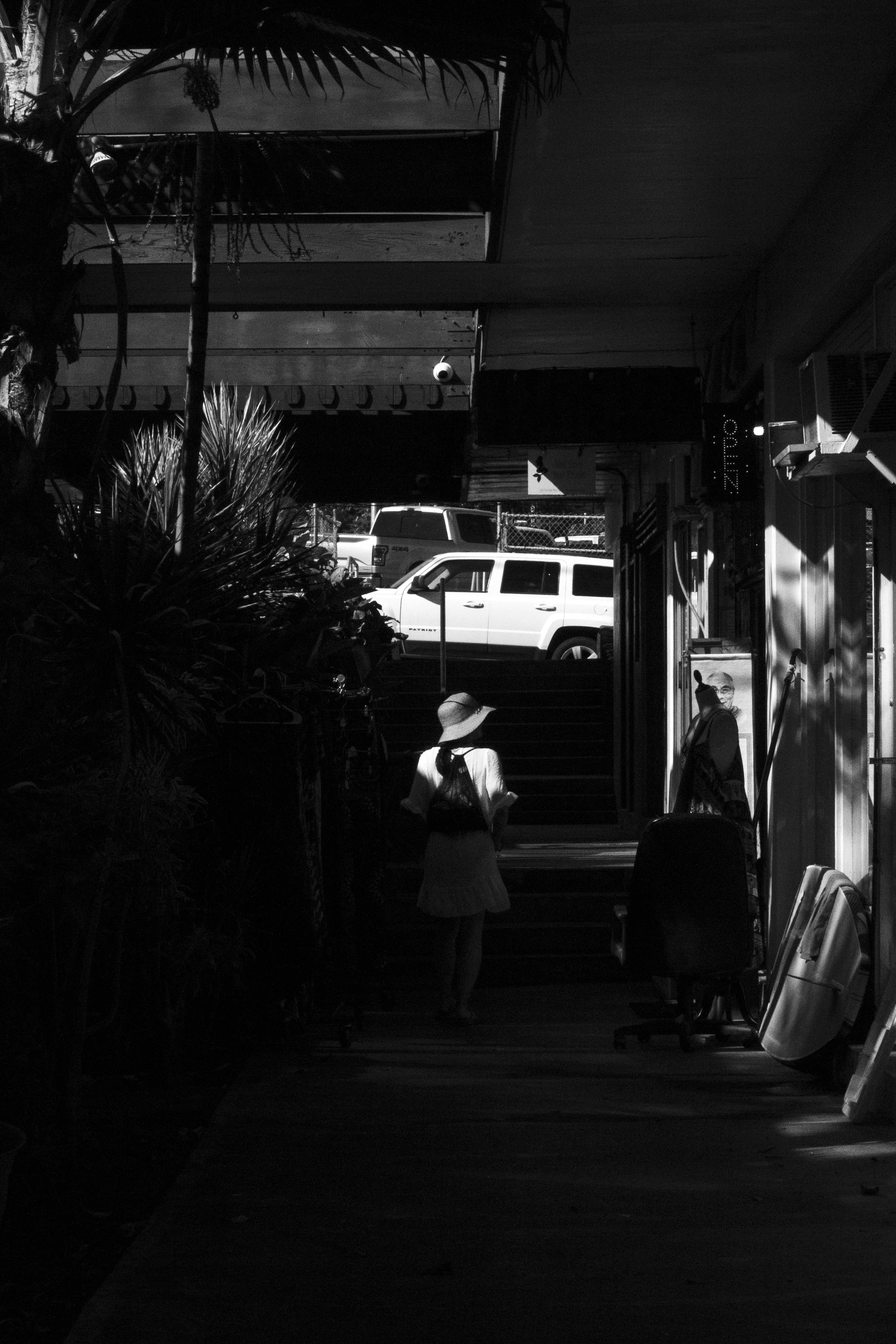 Hat in the Arcade: A Quiet Walk Through Shadow and Light