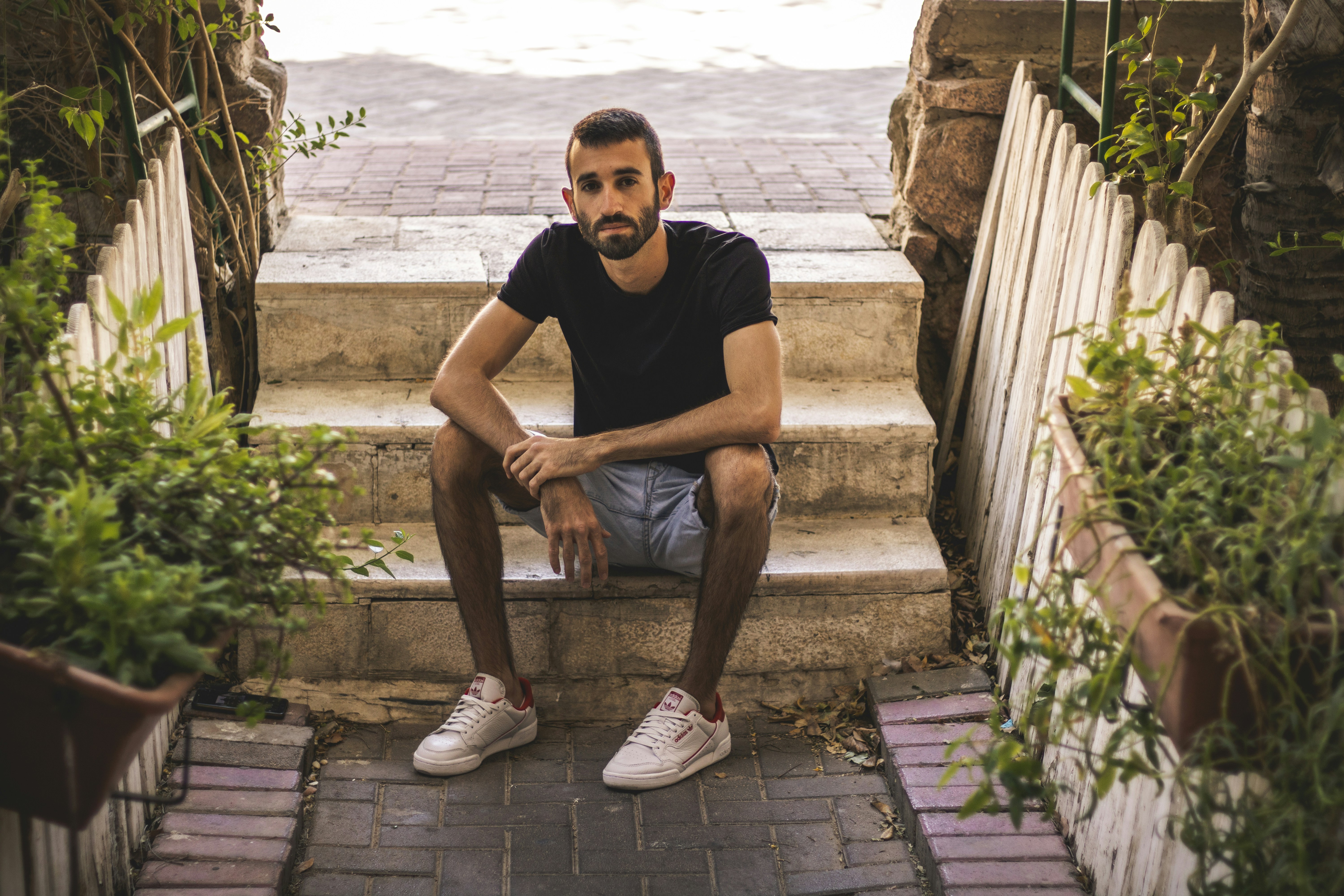 Solace on Stone Steps: A Portrait of Quiet Focus