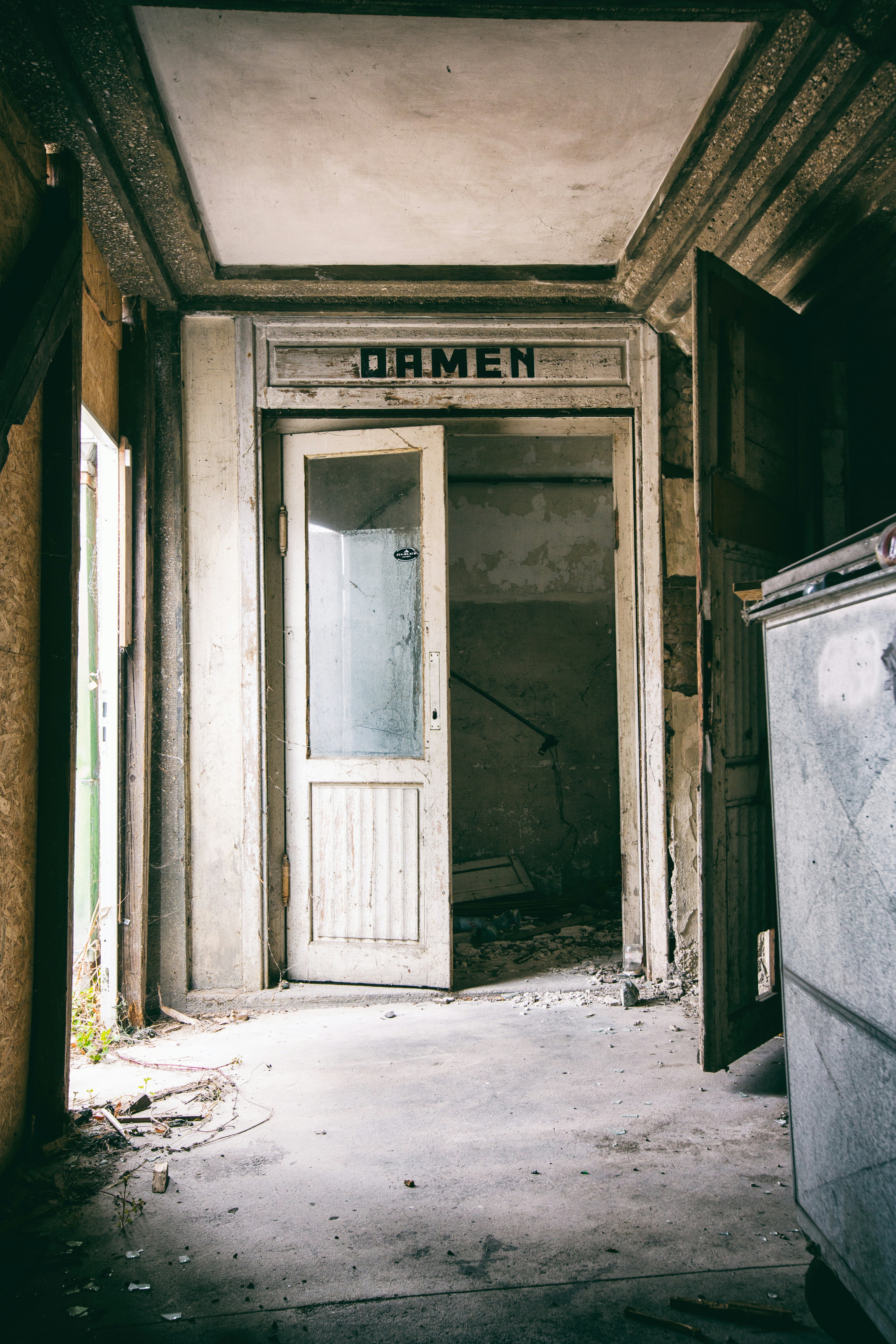 Entrance of the women's toilet in an abandoned building that is part of a historic trotting track ("Trabrennbahn Krieau") in Vienna, Austria.