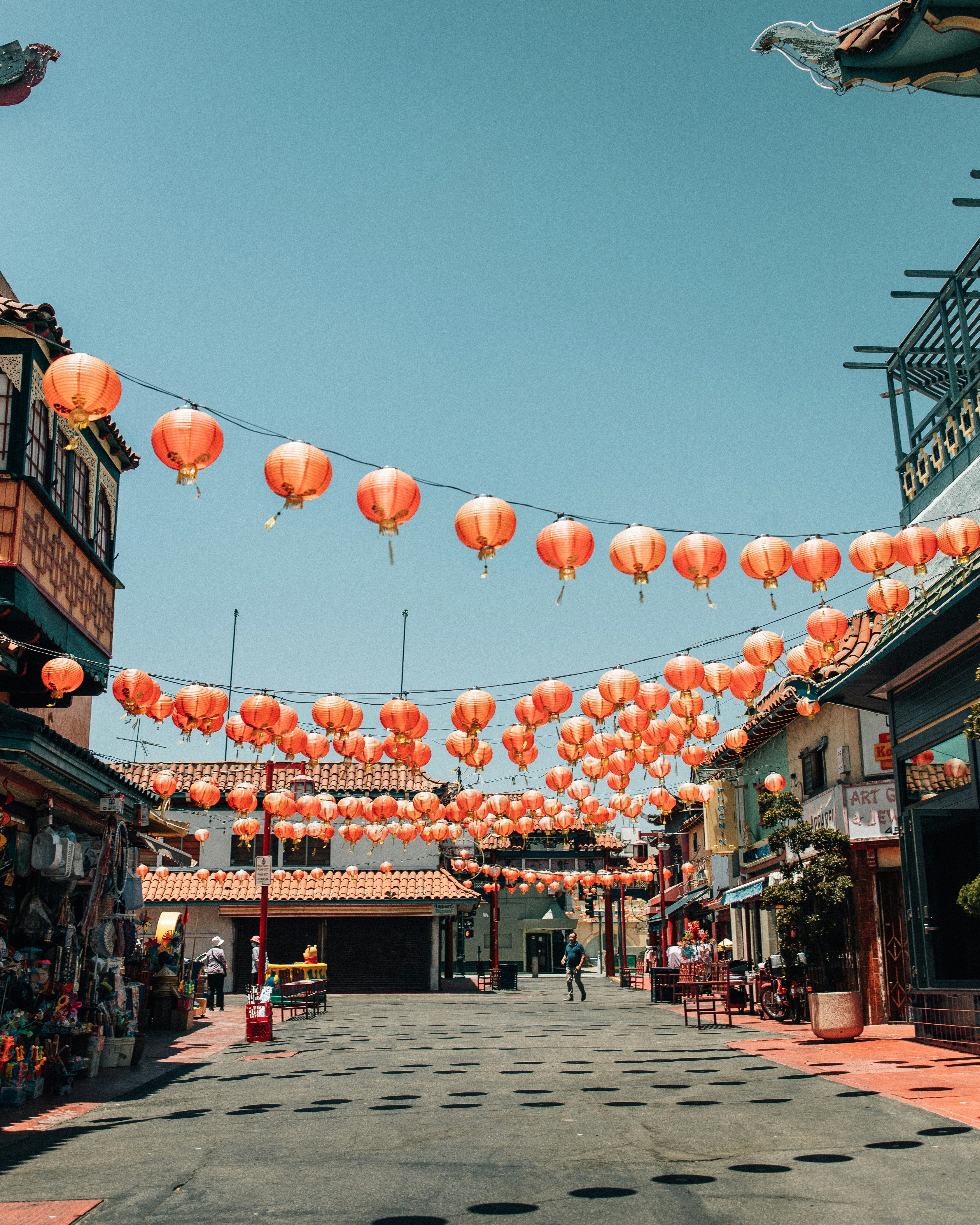Love it here in China town  | a street with buildings and lanterns