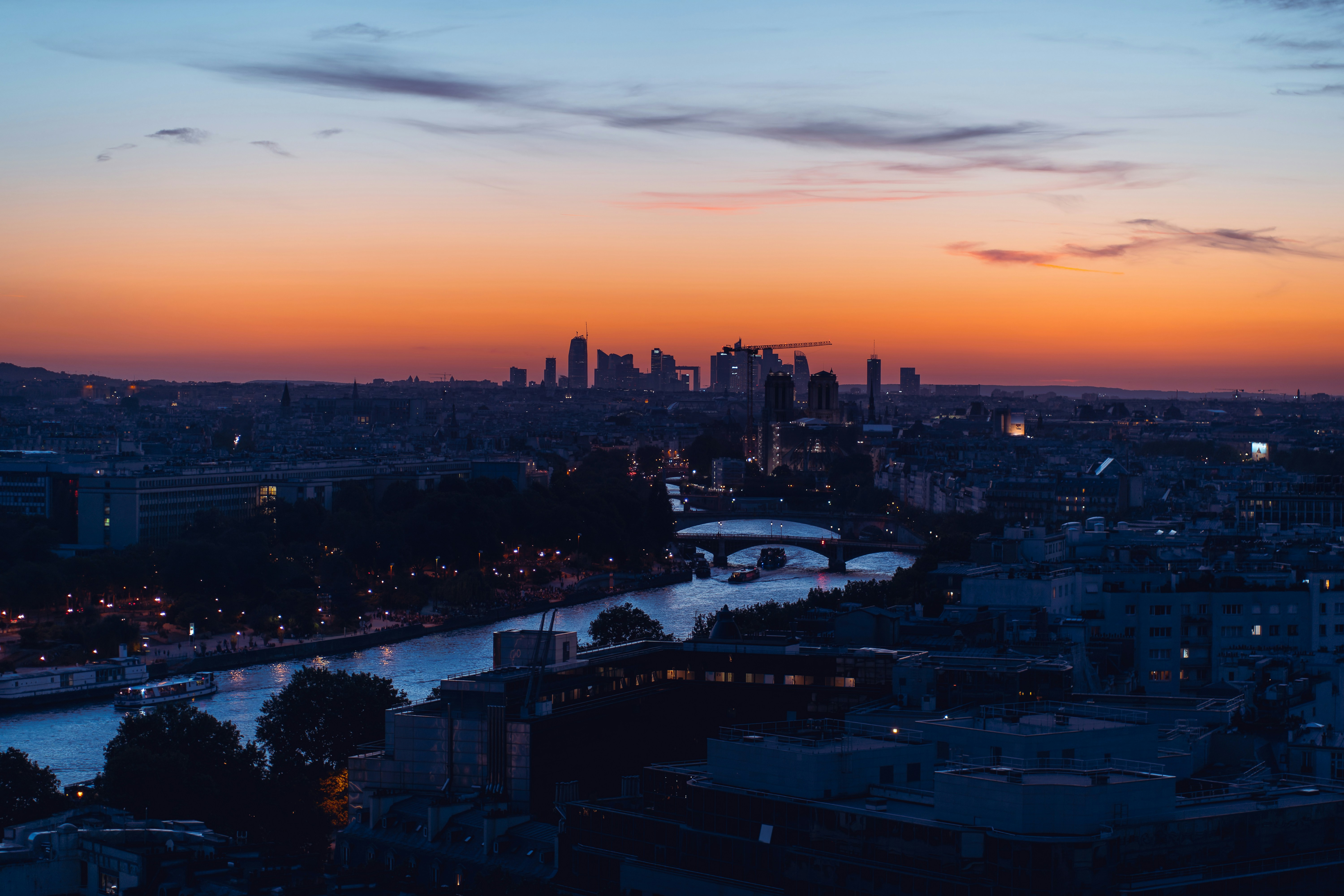 Orange Horizon Over the River: Cityscape at Blue Hour