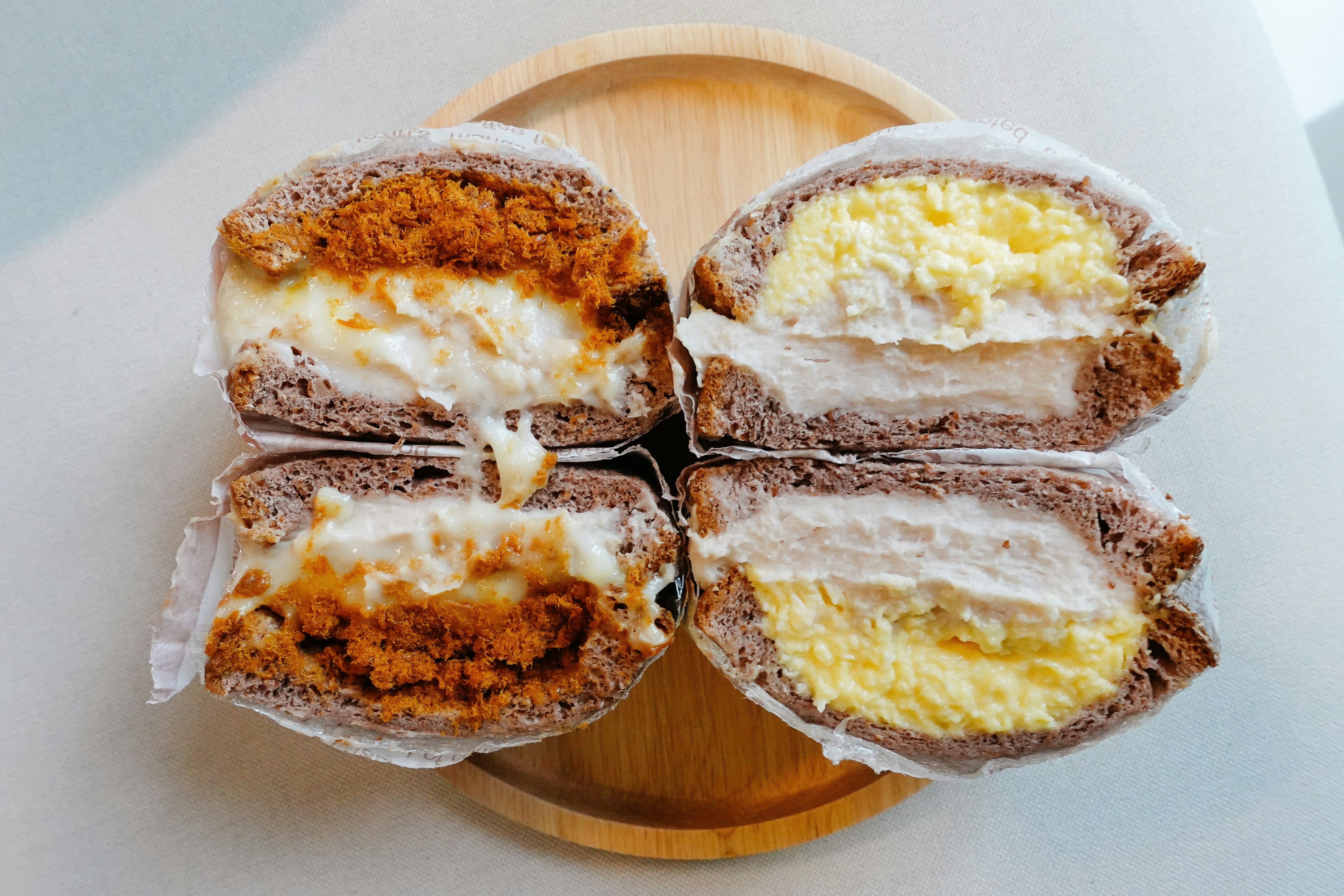 Quadruple Cream Reveal: Halved Pastries with Custard Cores and Crunchy Tops