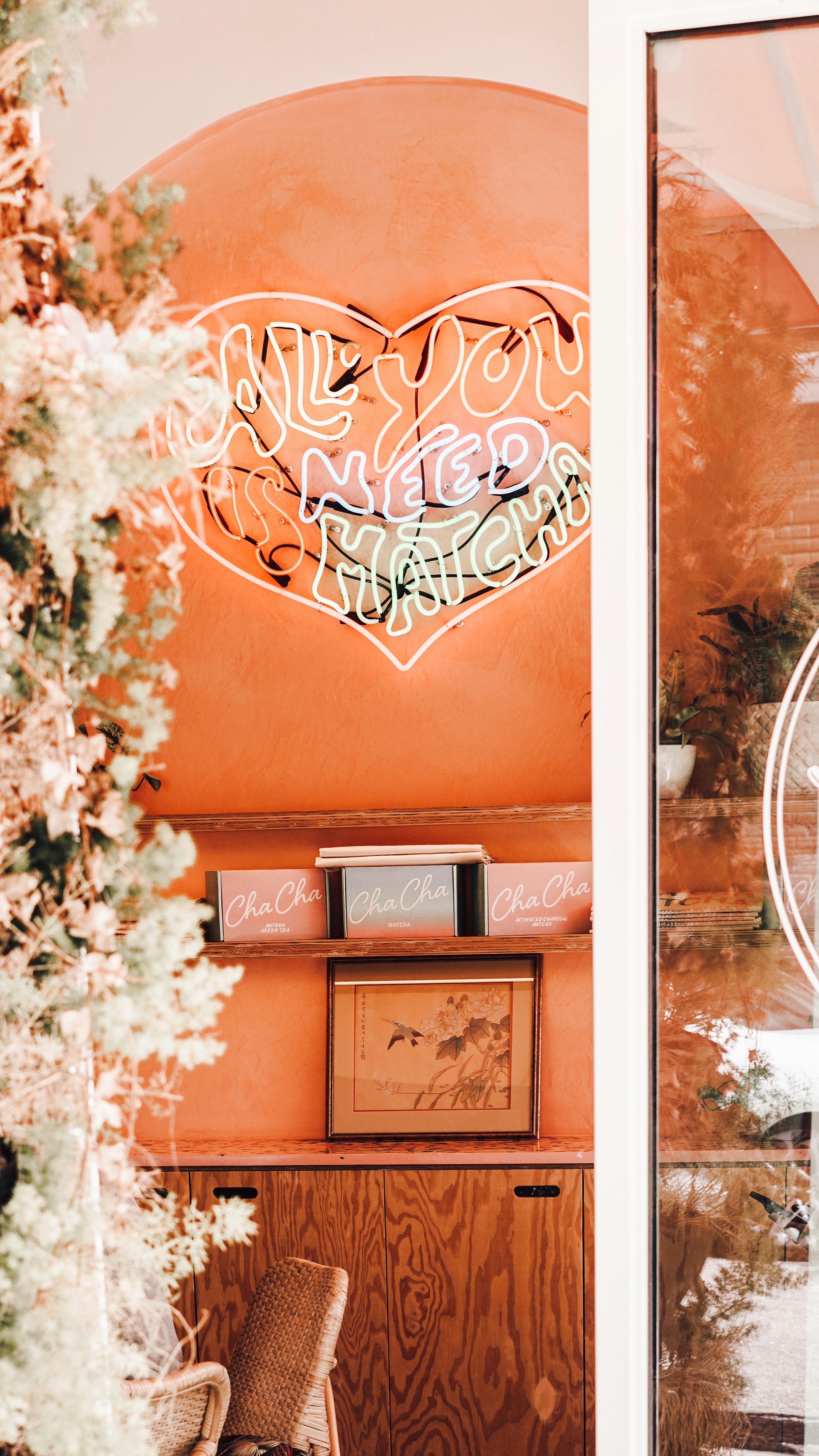 Peach Neon Heart Illuminates a Warm Boutique Window