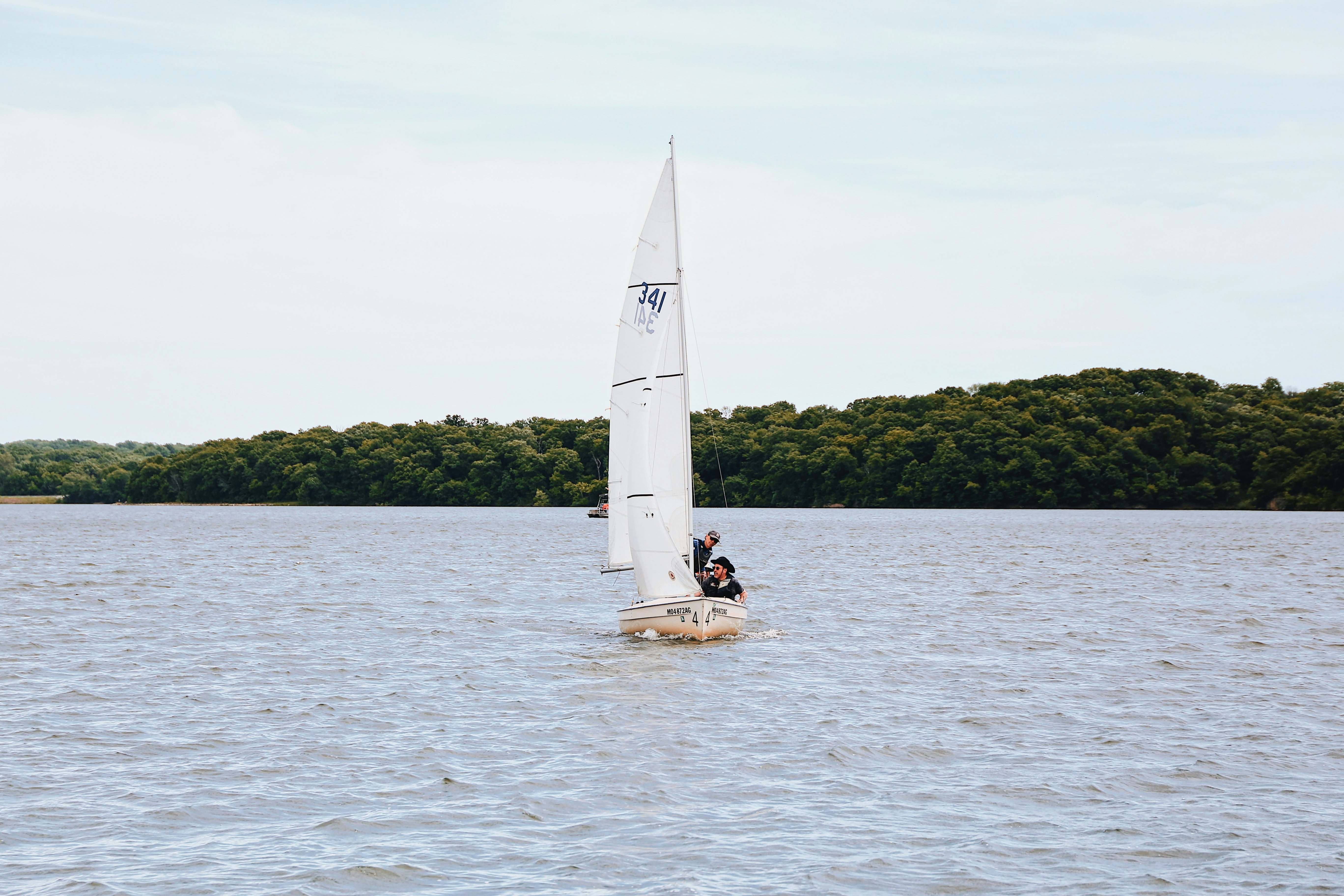 A sailboat on the water photo – Free Grey Image on Unsplash