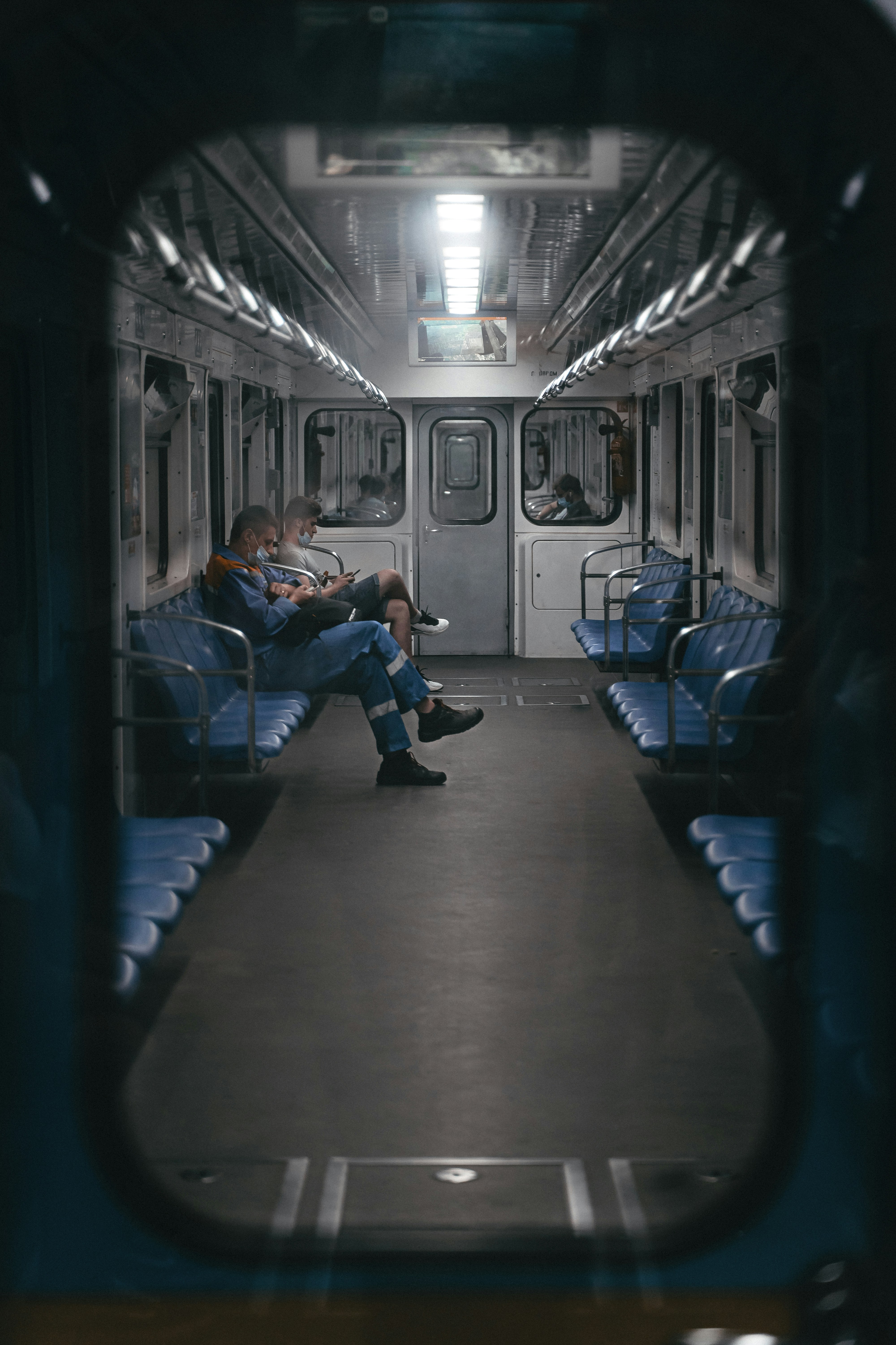A couple of people sit on a train photo – Free Grey Image on Unsplash