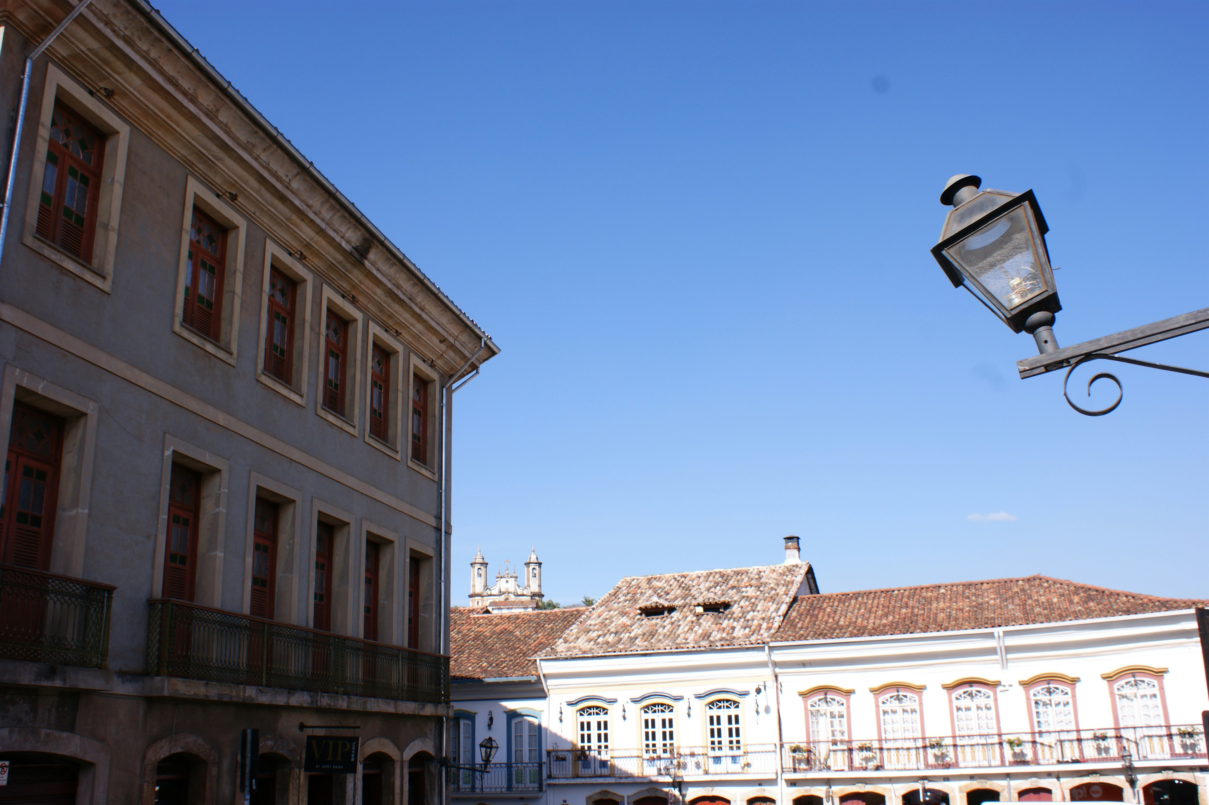 A street light and buildings photo – Free Blue Image on Unsplash