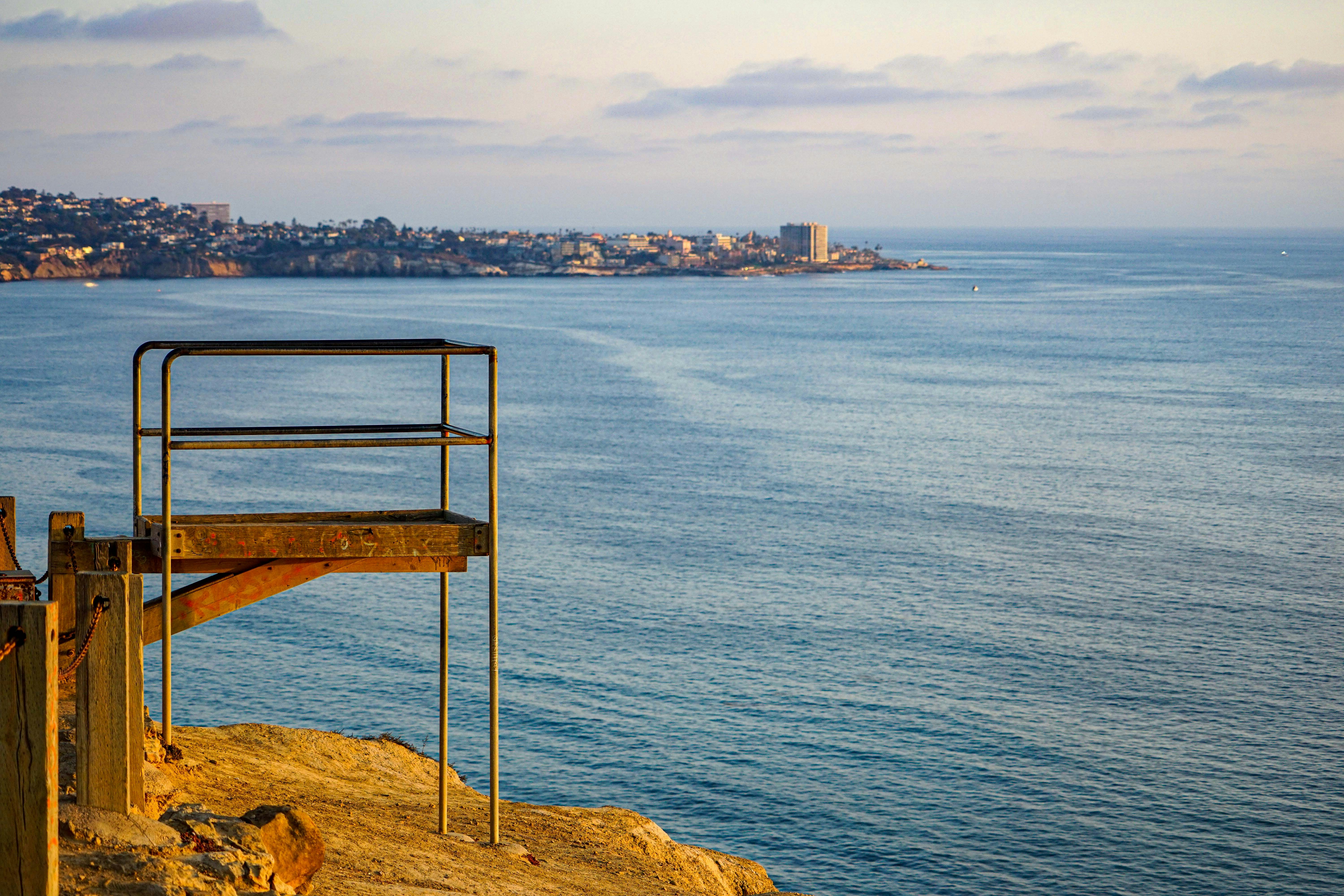 A bench overlooking a body of water photo – Free Gliderport trail Image ...