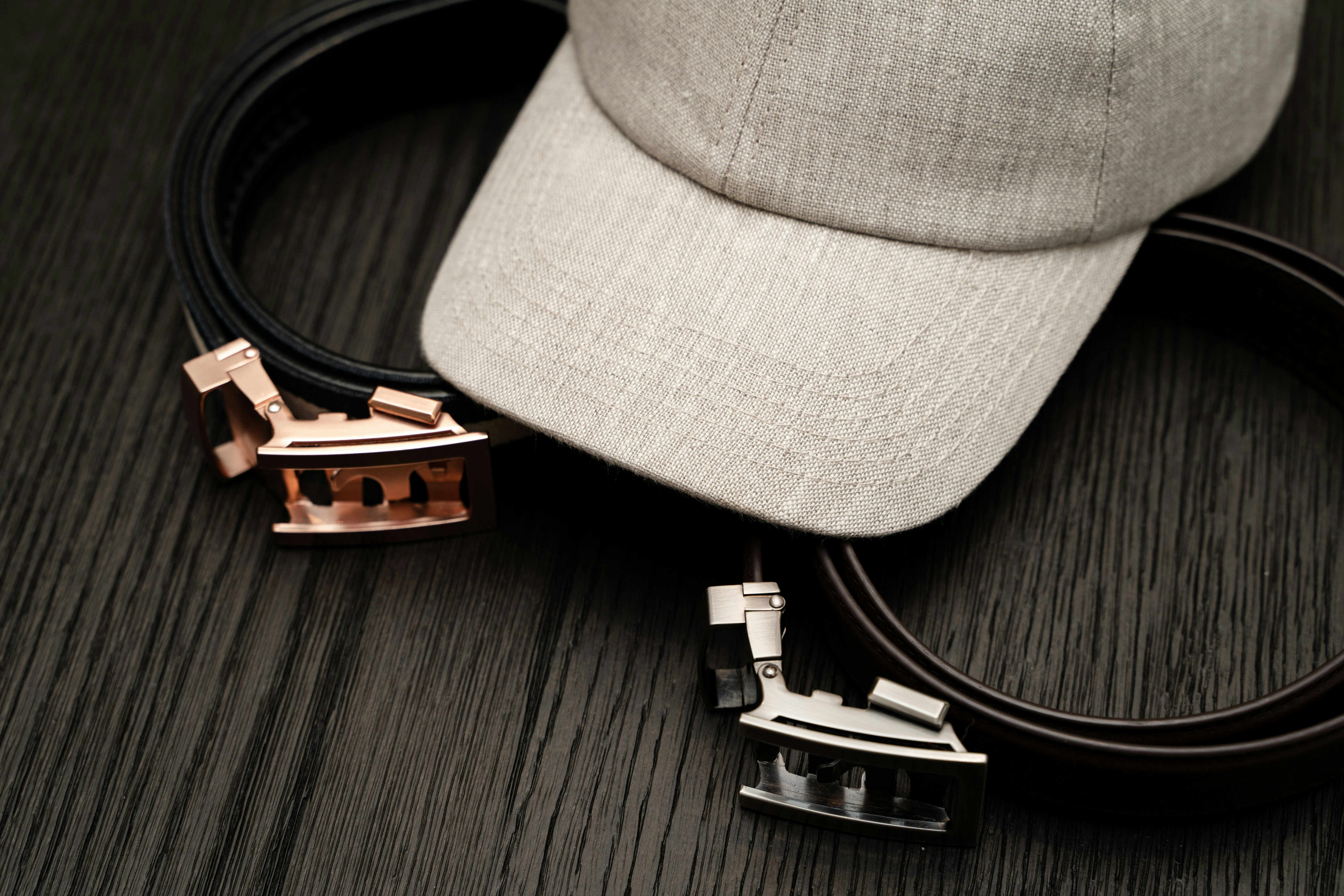 Copper Buckle Quietude: Close Portrait of Leather, Cap, and Wood
