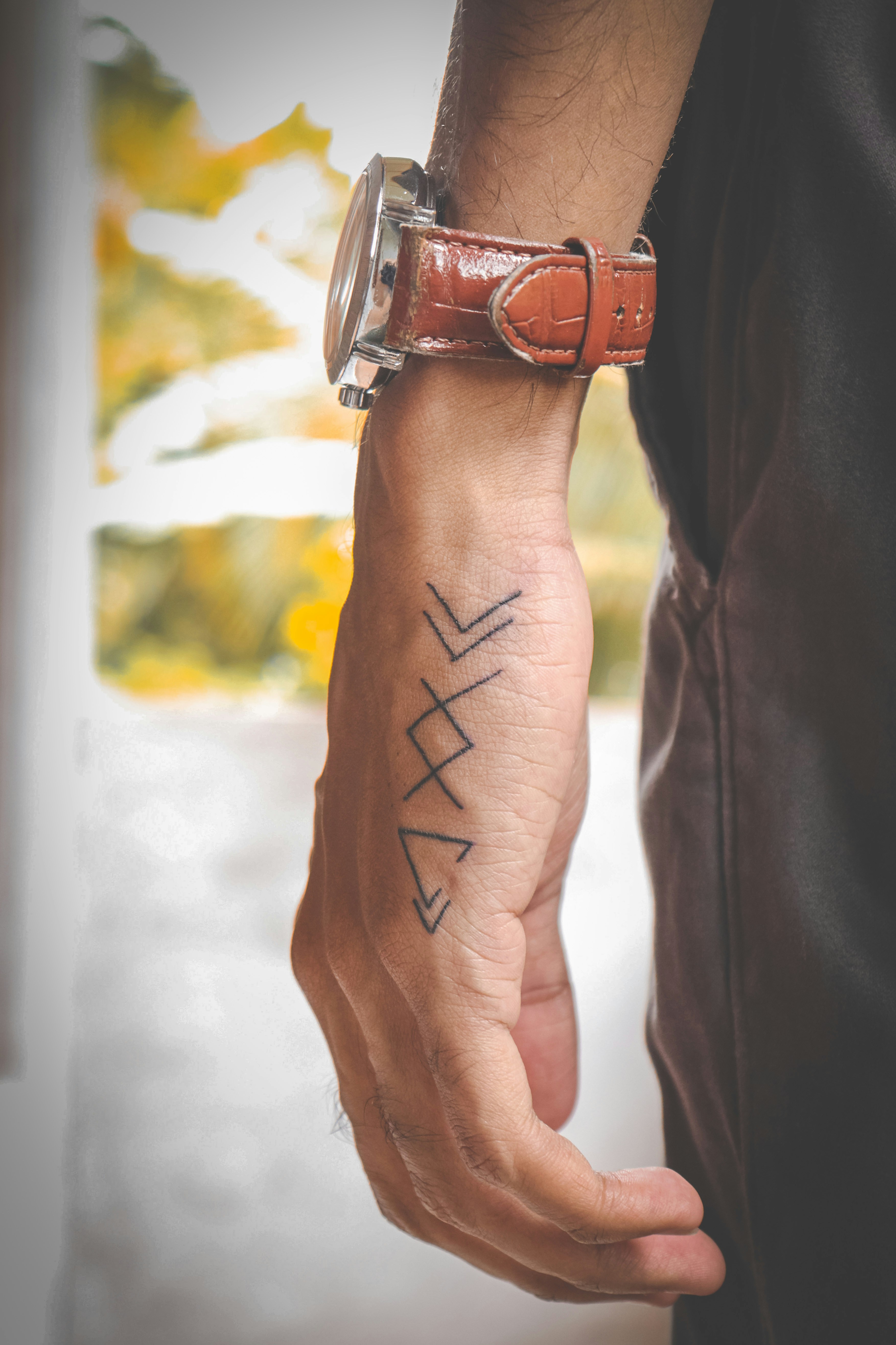 Tattooed Geometry on a Resting Arm