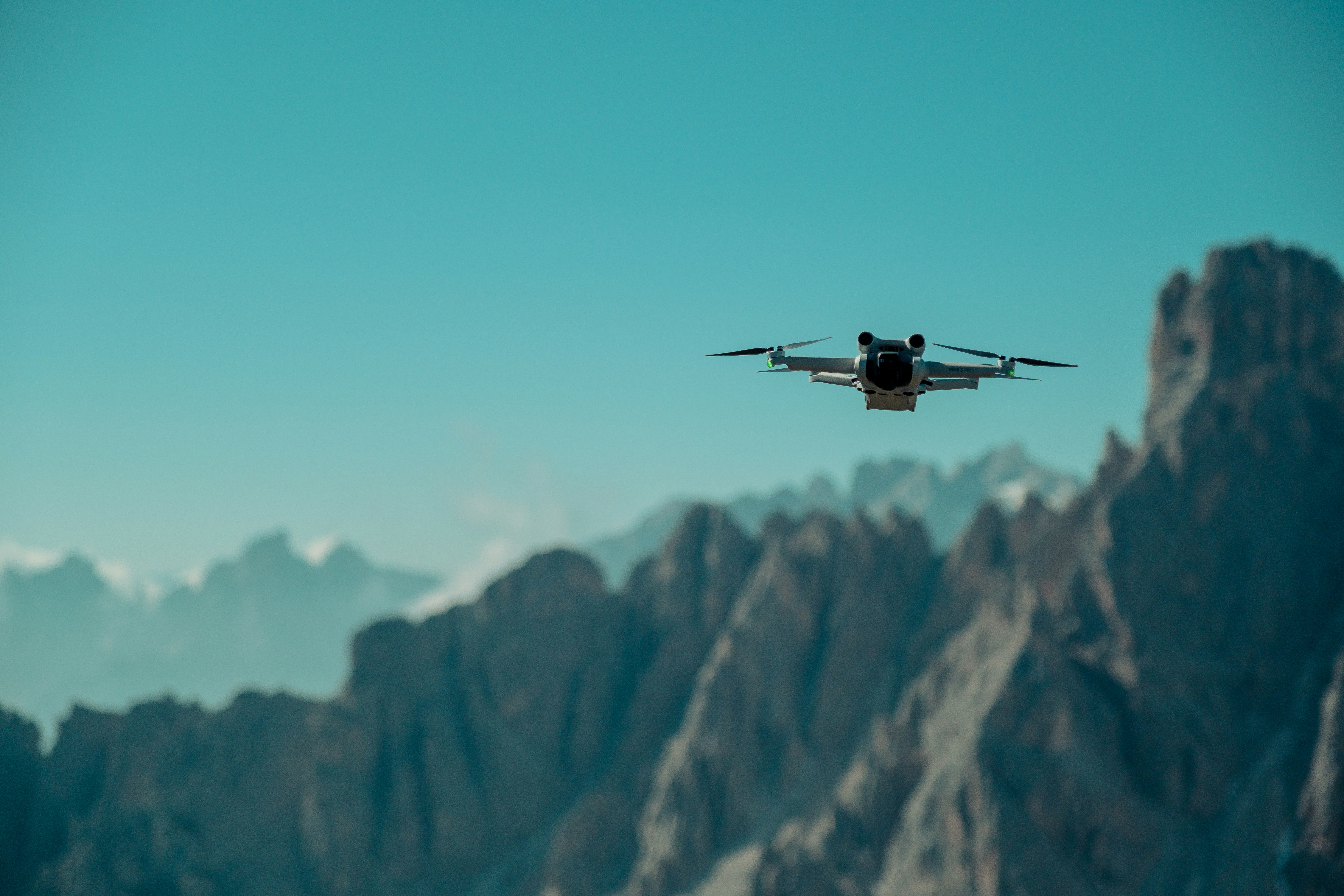 An airplane flying over a mountain photo – Free Dolomites Image on Unsplash
