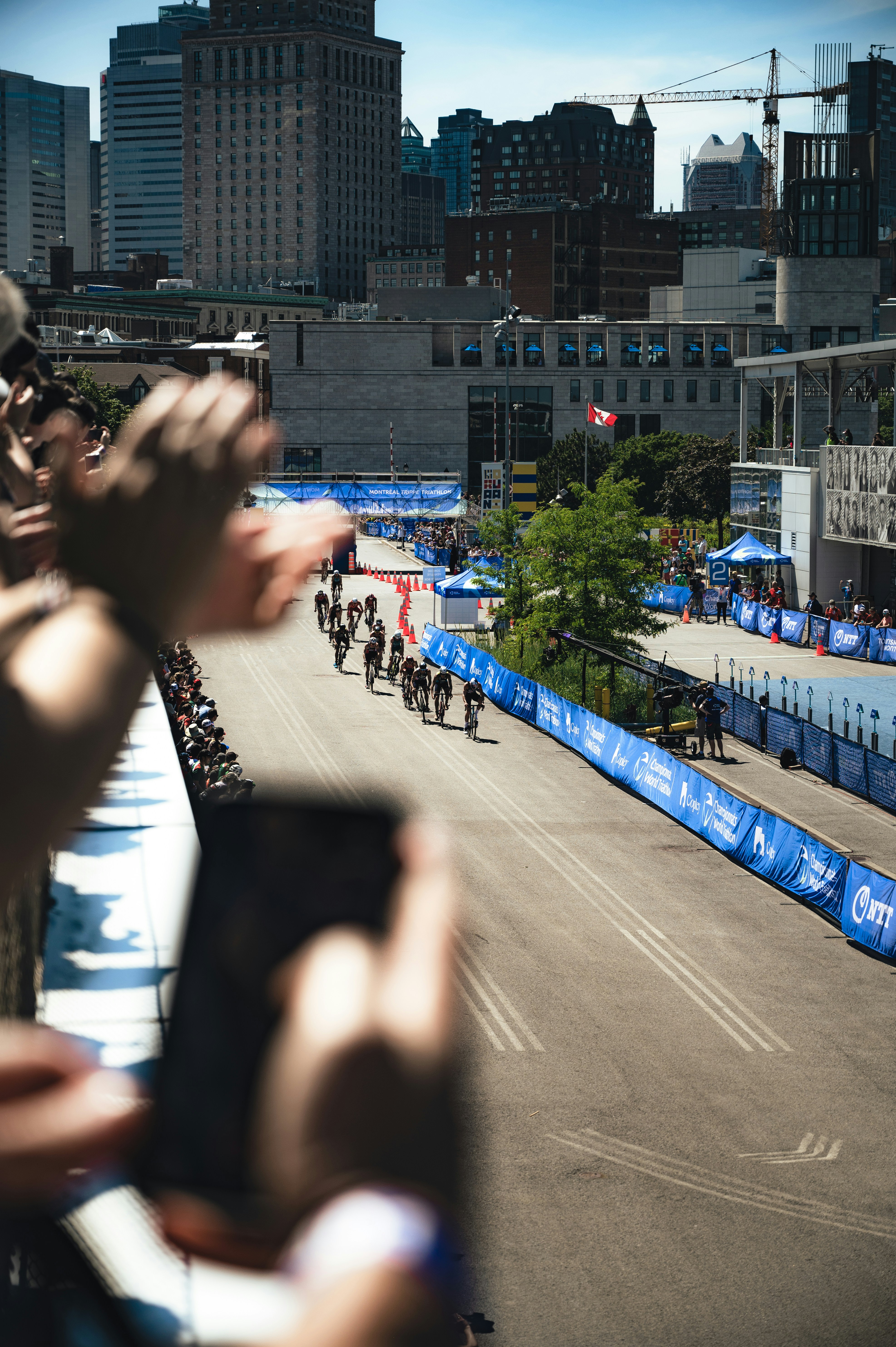 Crowds Recede as Cyclists Surge Through Downtown Start Line