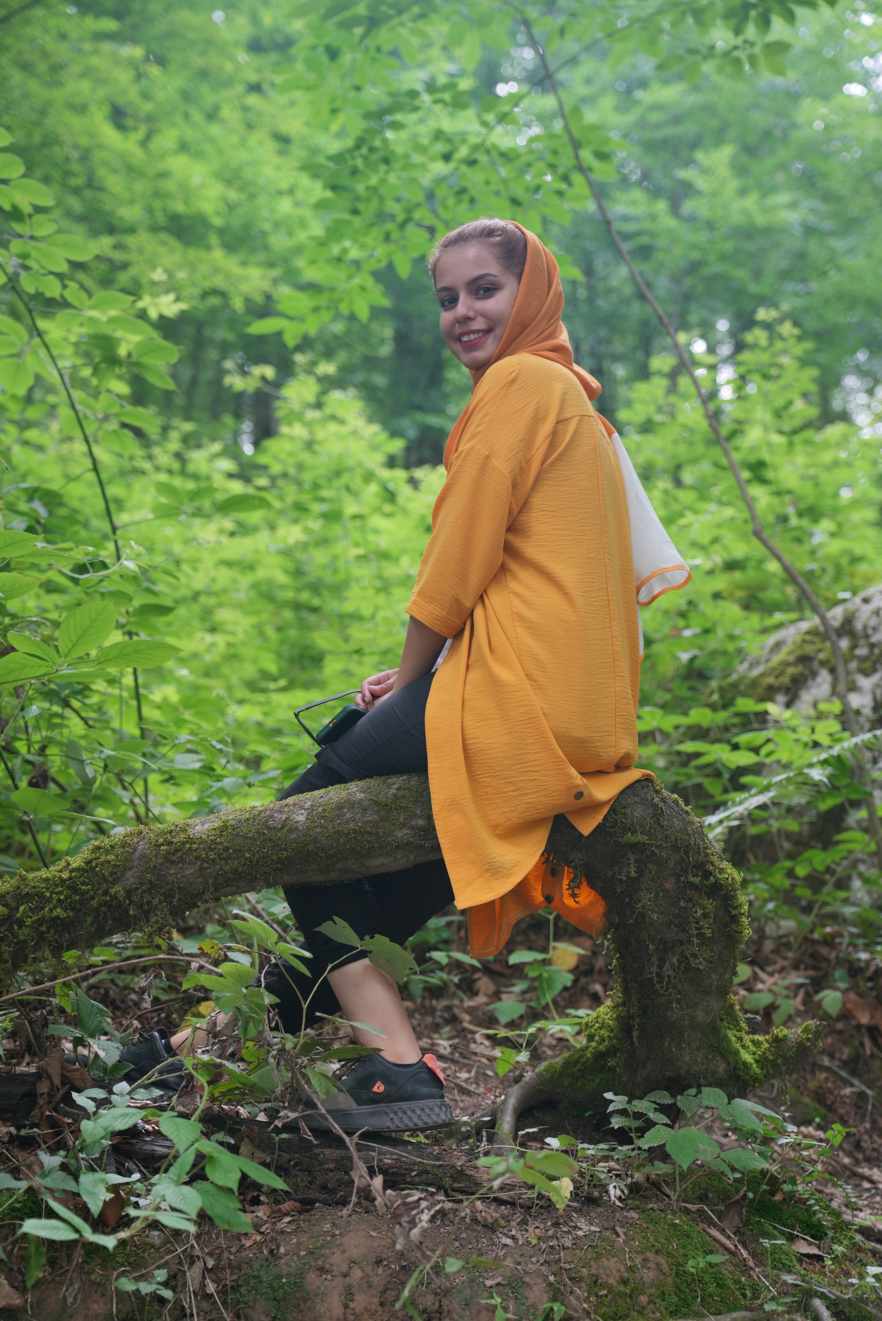 View of a charming girl posing in nature